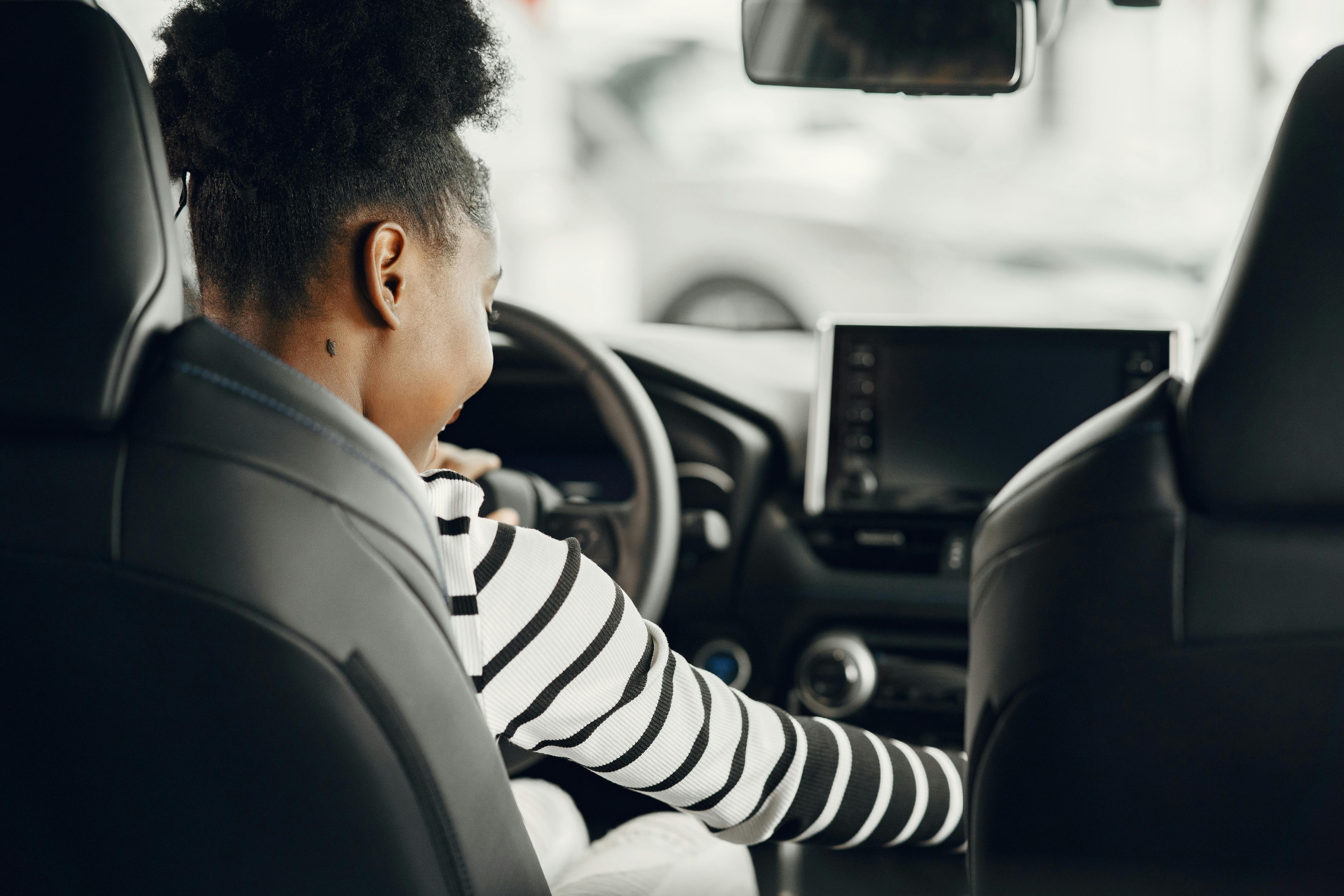 Girl Sitting in a Car · Free Stock Photo