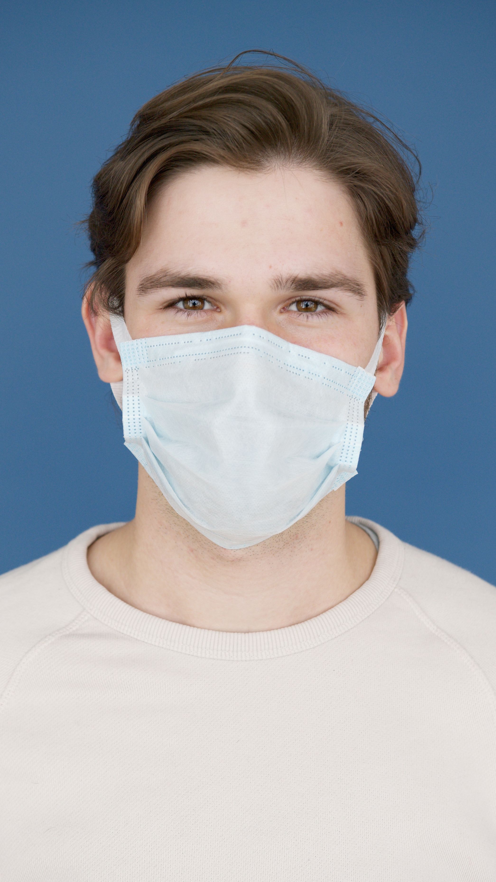 Two Men in Face Masks Photographed from behind a Window · Free Stock Photo