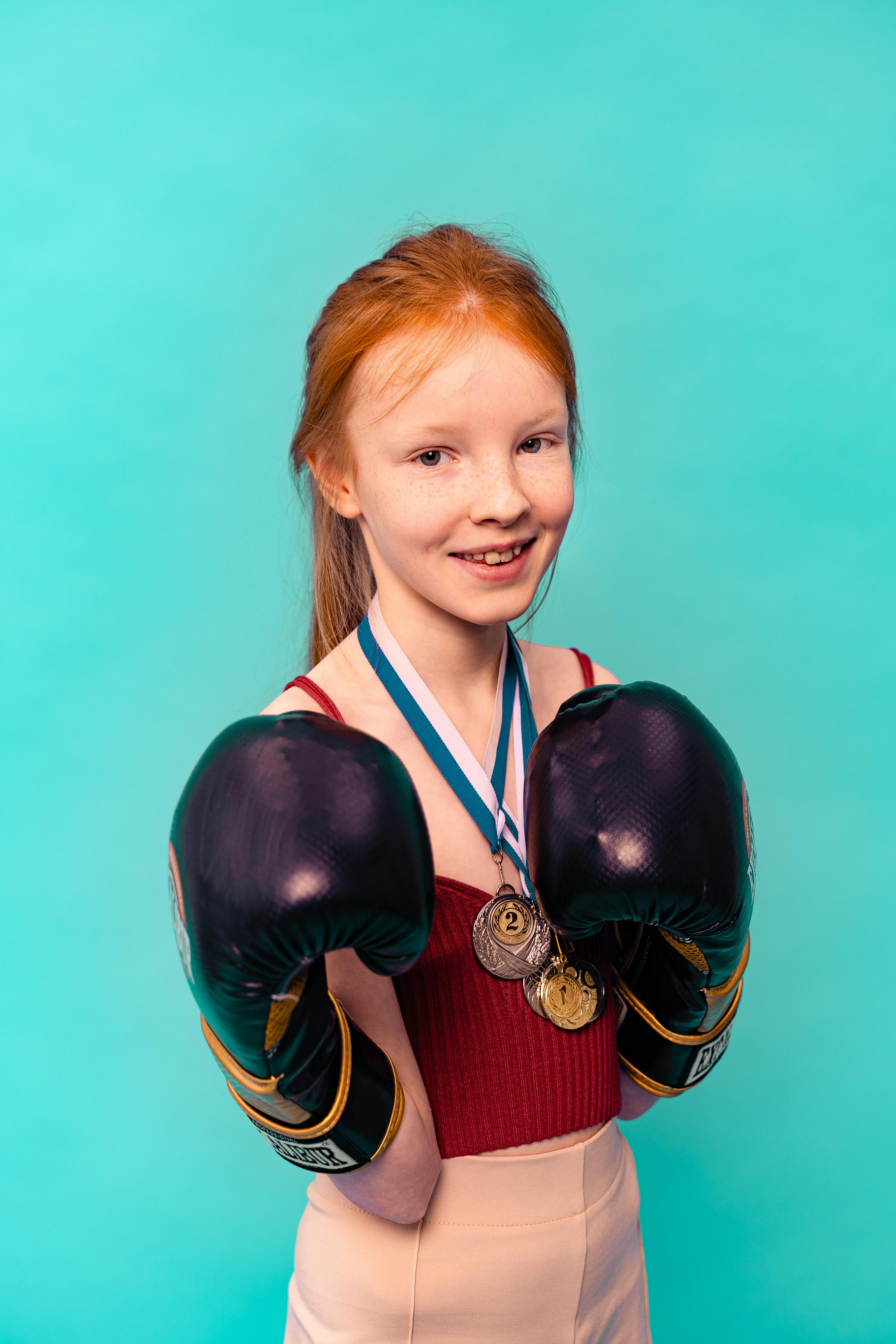 Photo of a Girl Boxing Champion With Medals · Free Stock Photo