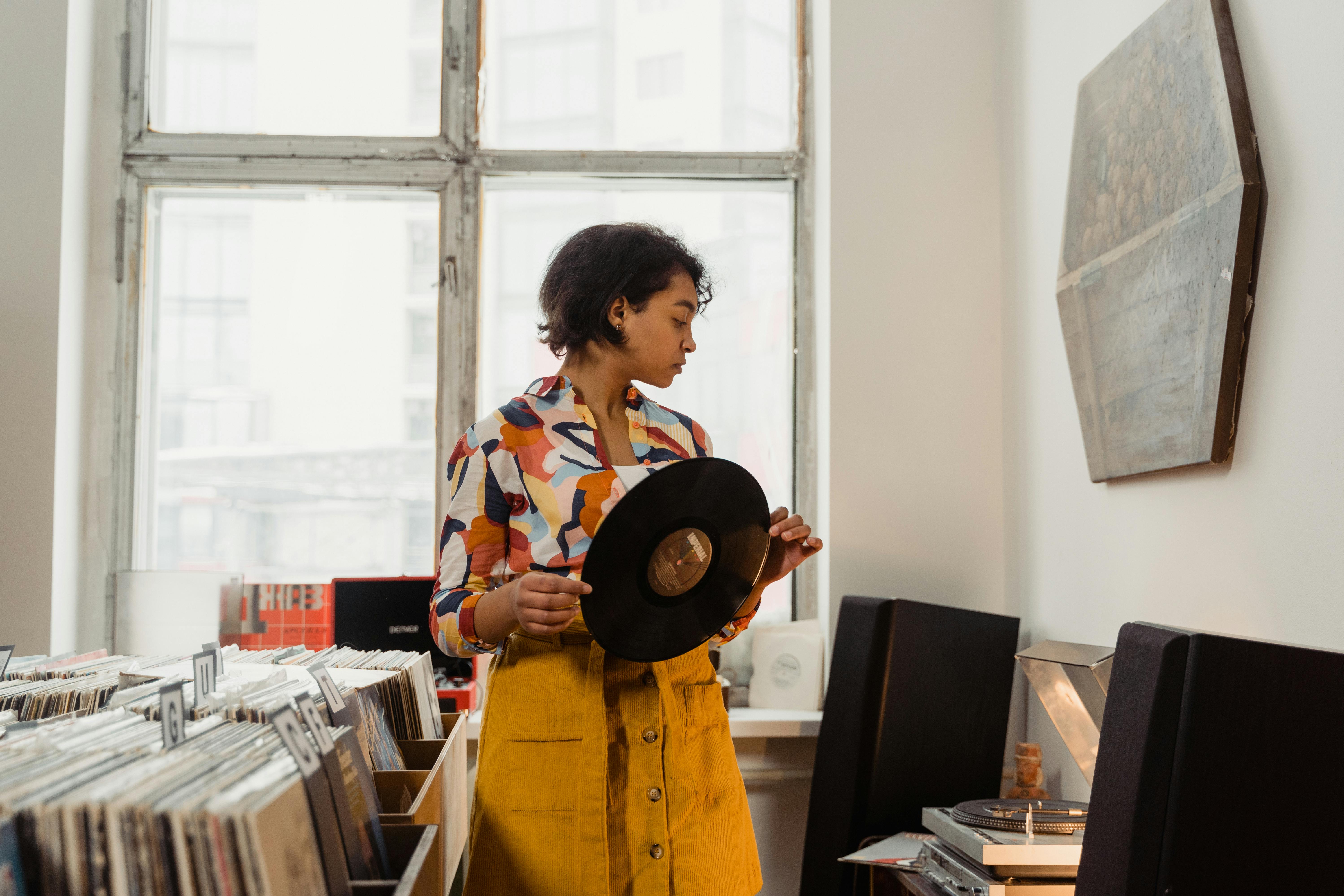Man Holding Vinyl Record · Free Stock Photo