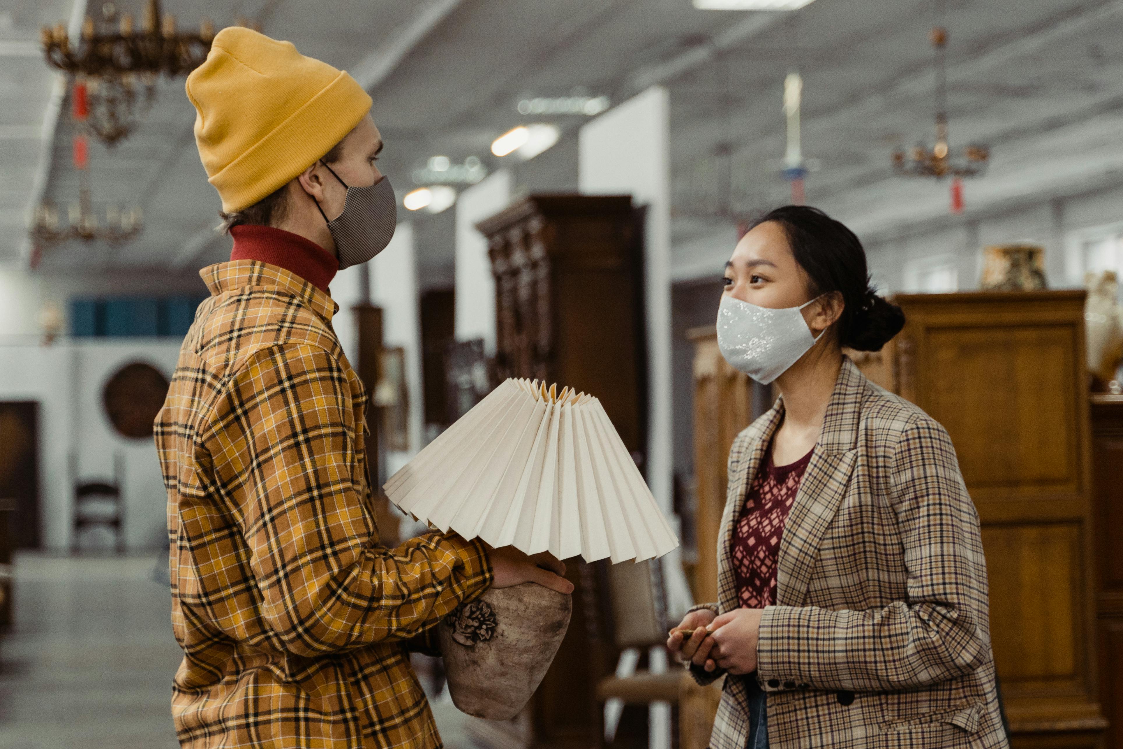 A Man and a Woman Inside an Antique Store · Free Stock Photo