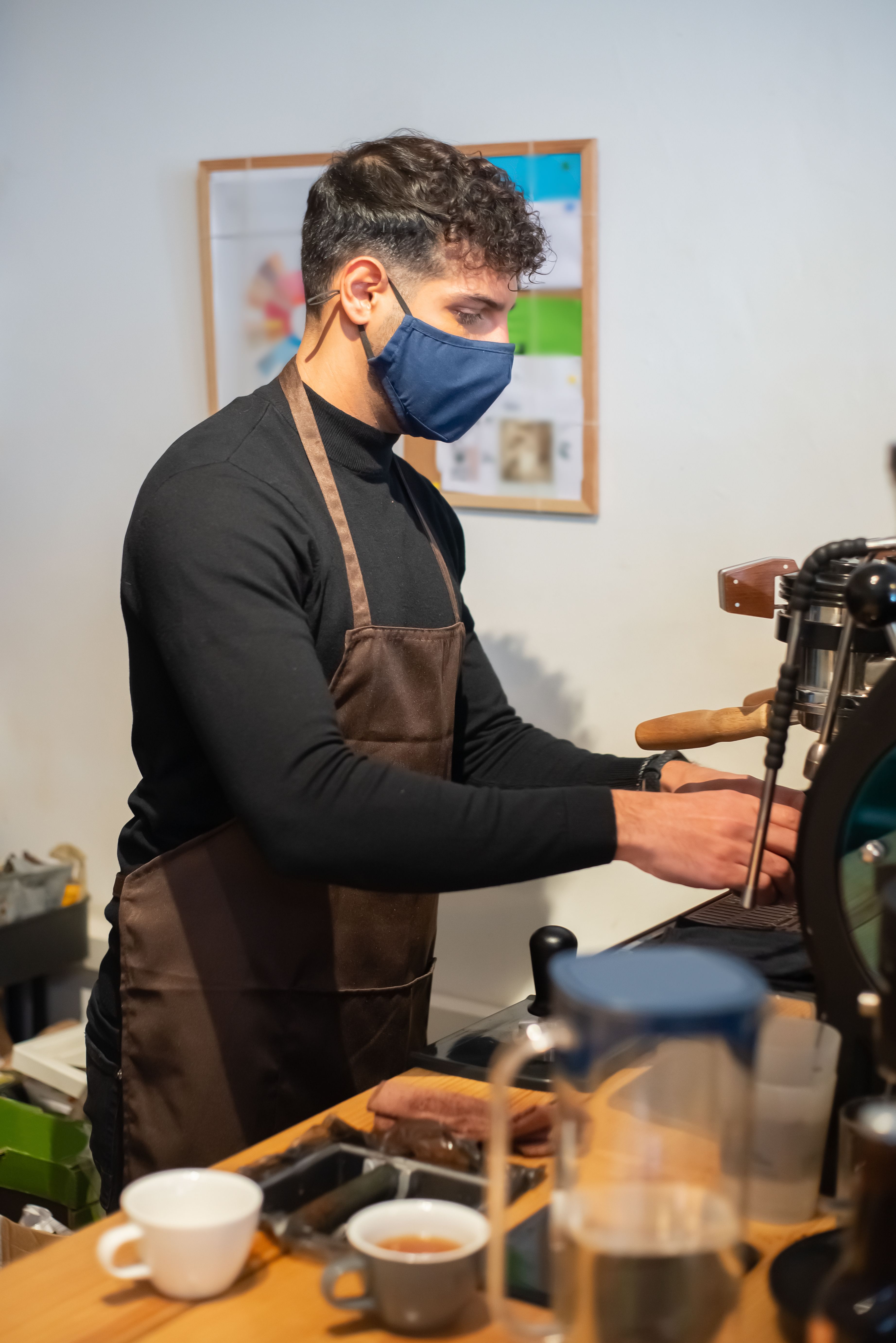 Close-up od a Barista Making Coffee · Free Stock Photo