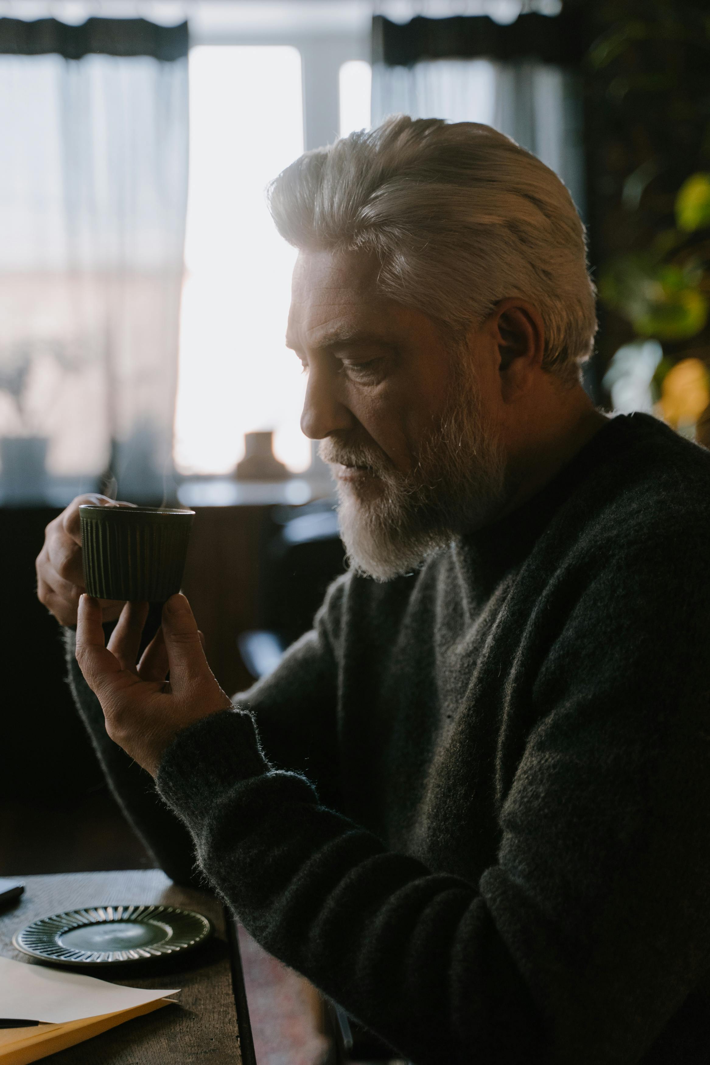 A Man Sitting at the Table · Free Stock Photo