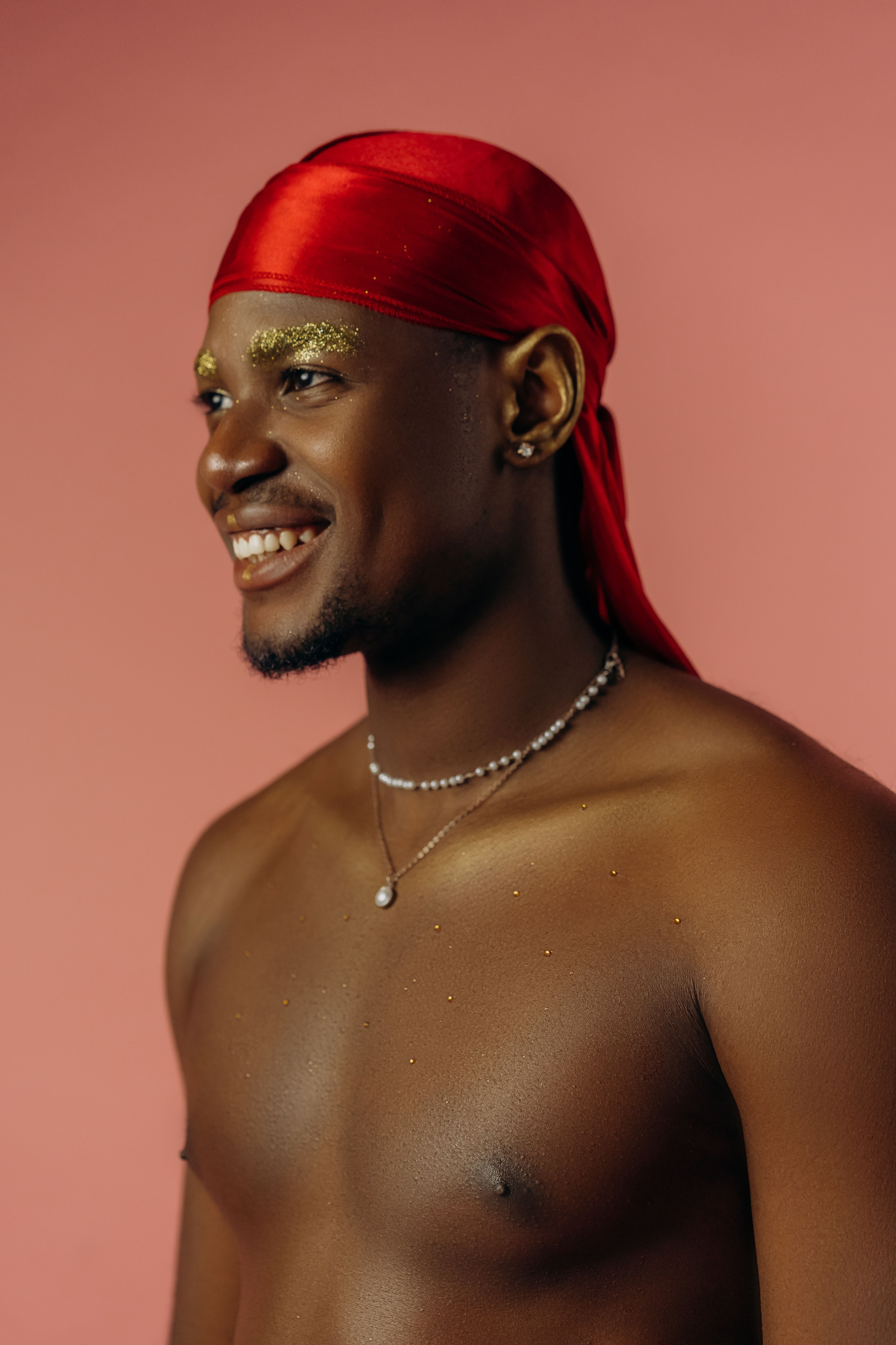 Shirtless Man Wearing Red Durag Smiling · Free Stock Photo