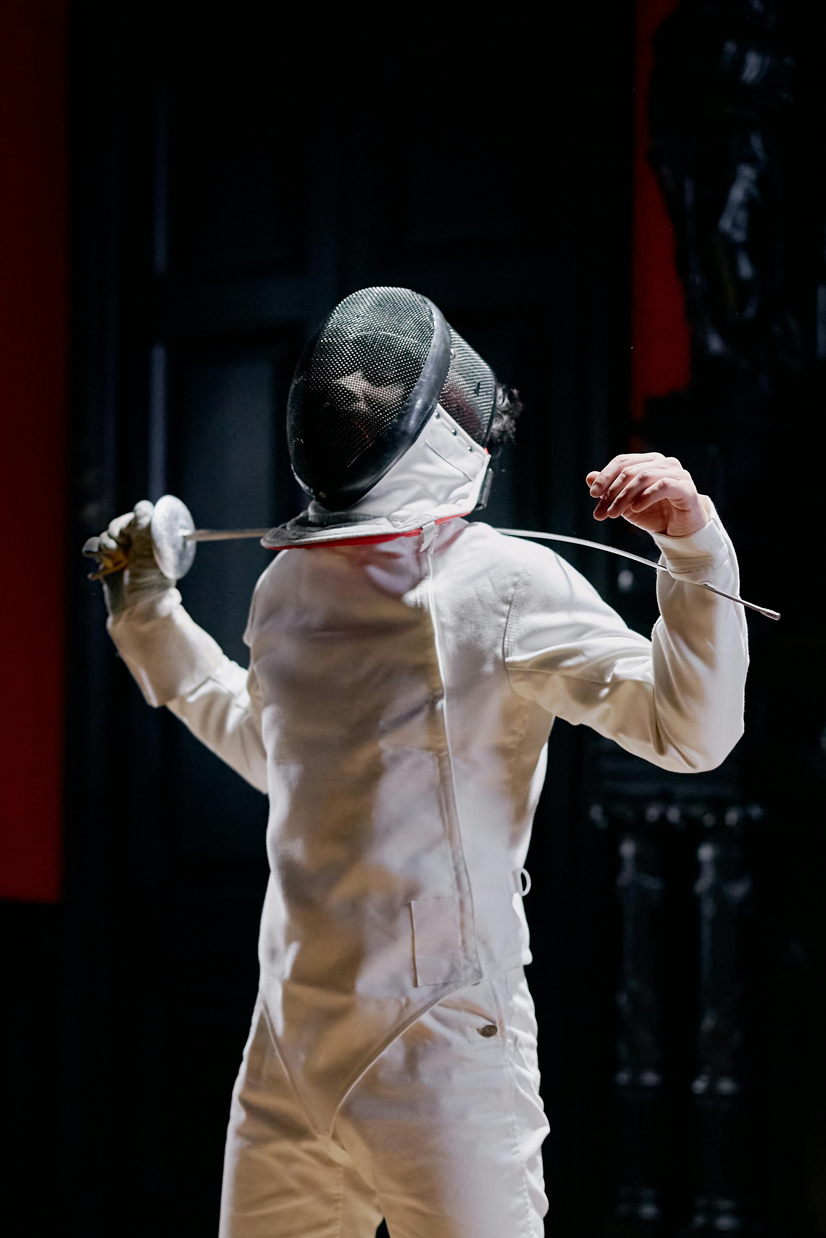 A Fencer in Full Fencing Gear · Free Stock Photo