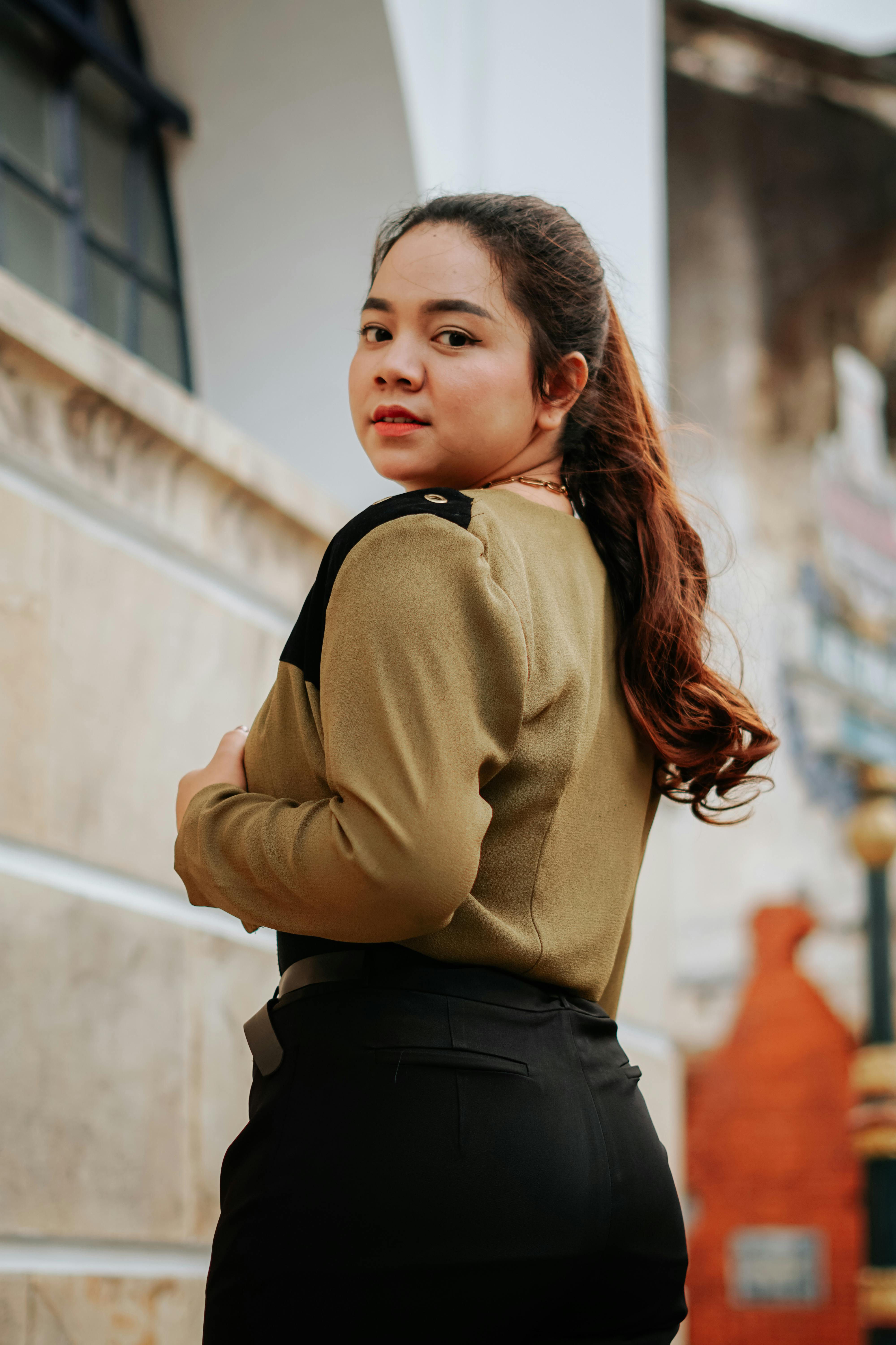 A Beautiful Woman Looking Over Her Shoulder · Free Stock Photo