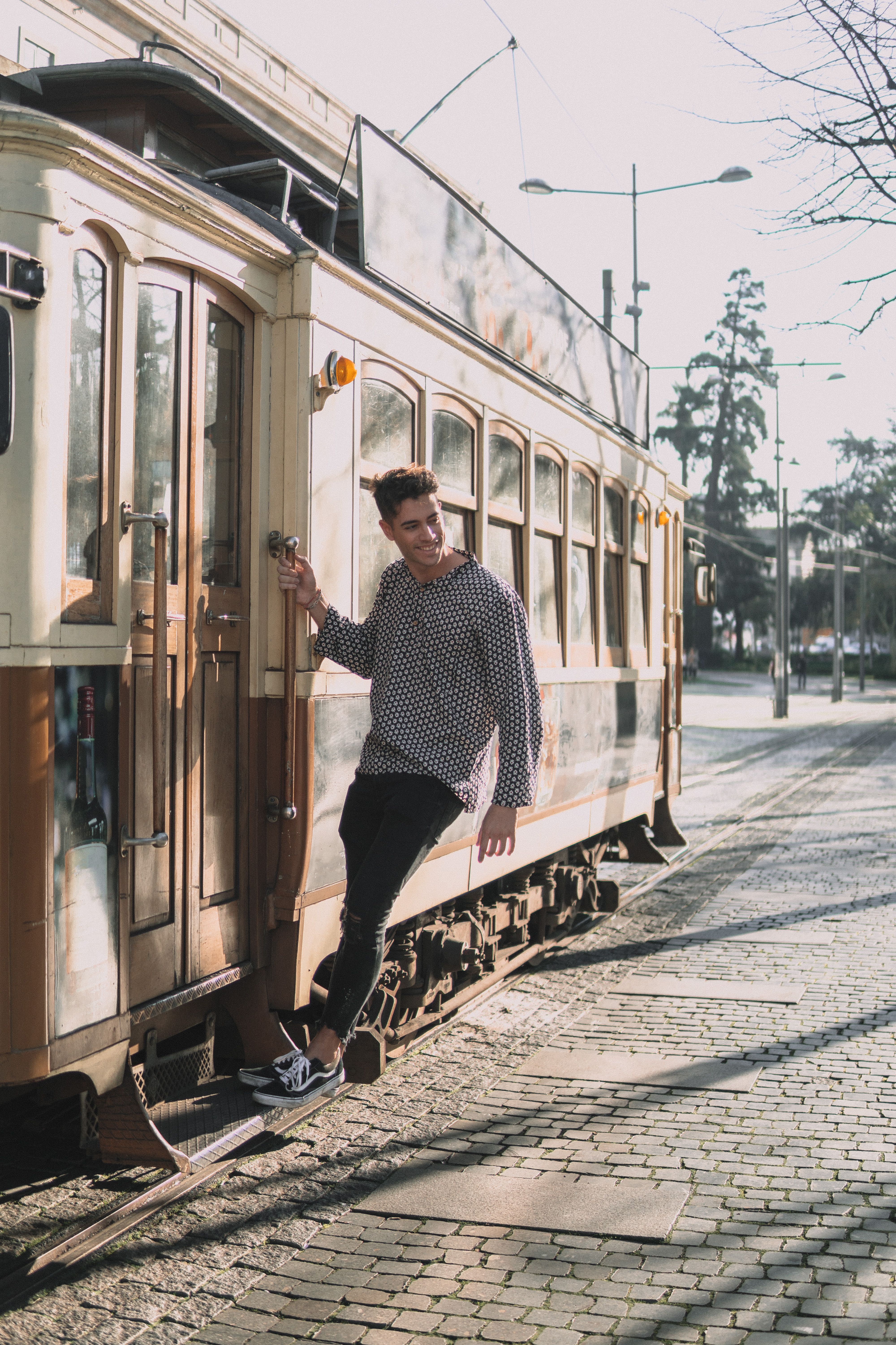 Man hanging on a Tram · Free Stock Photo