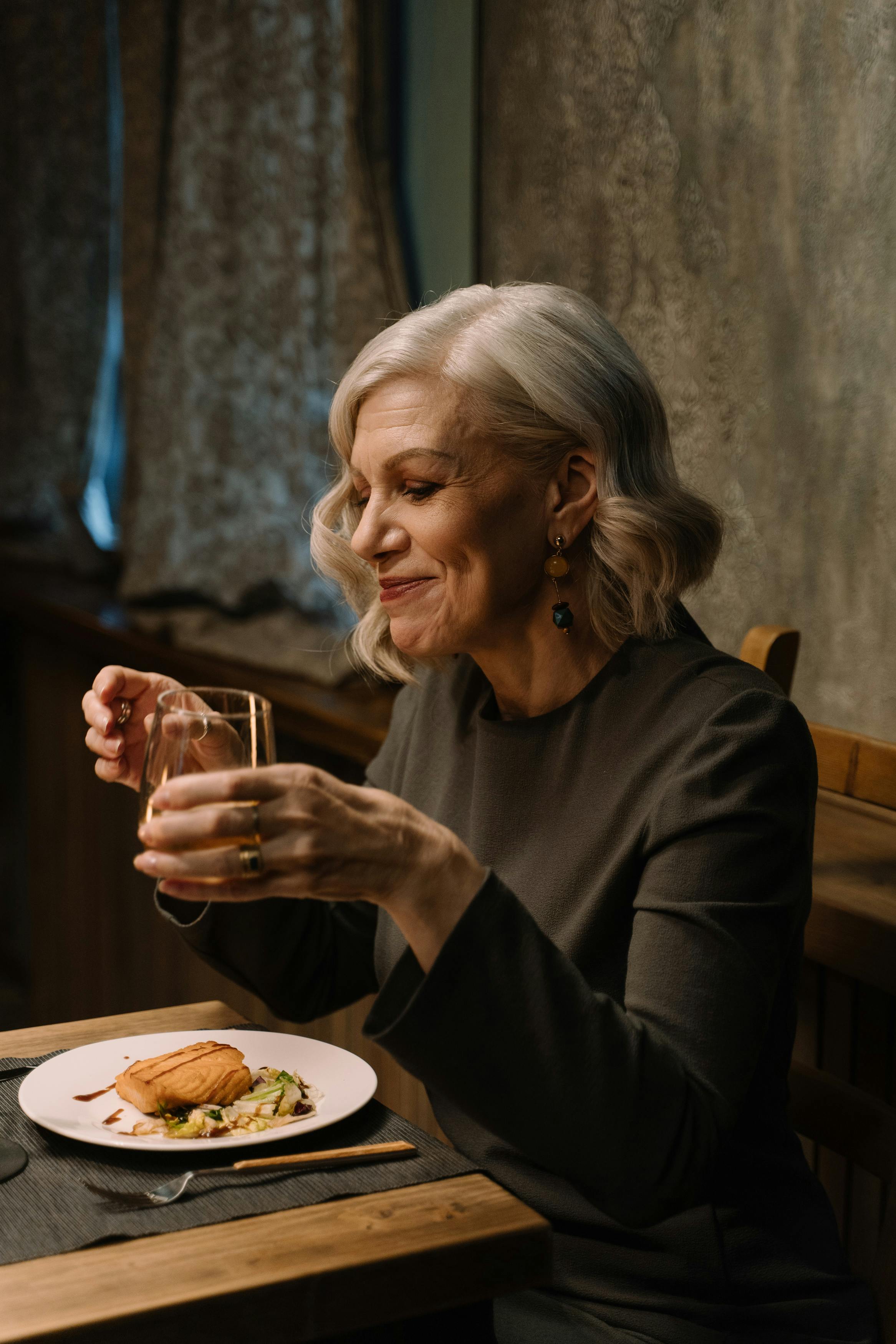 An Elderly Woman Having Dinner · Free Stock Photo