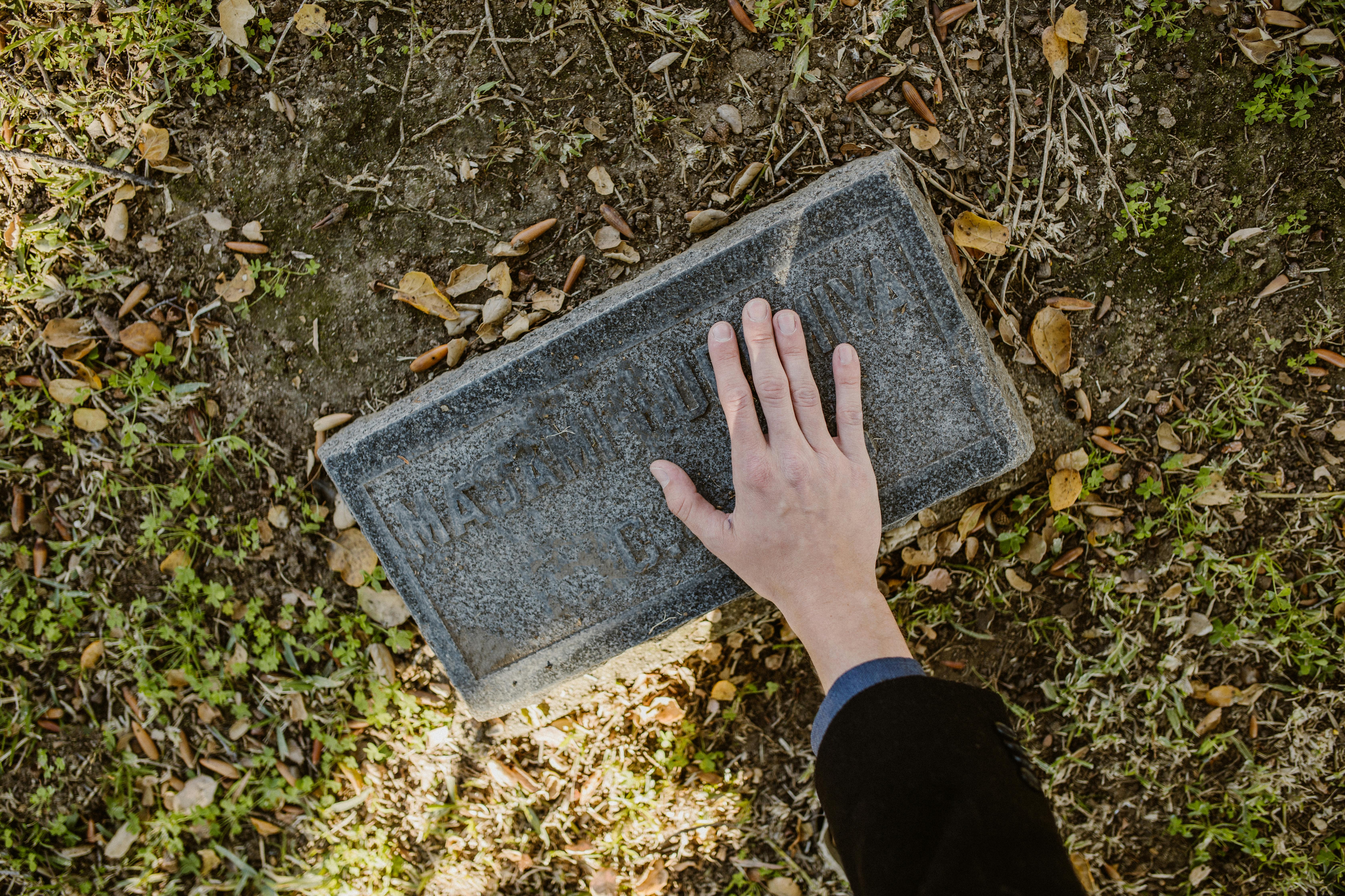 A Person Touching Gravestone · Free Stock Photo