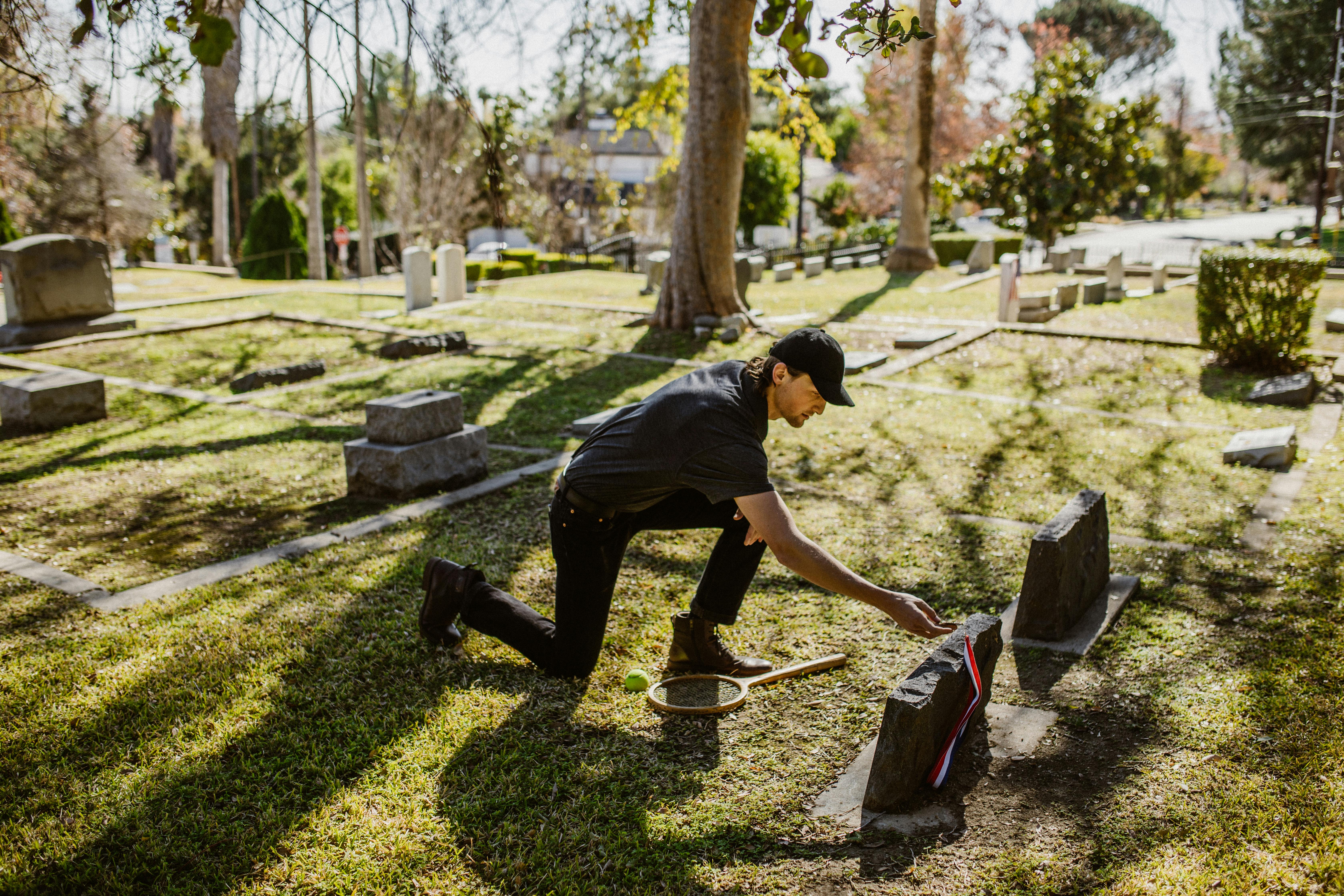 Man visiting a Grave of a Beloved · Free Stock Photo