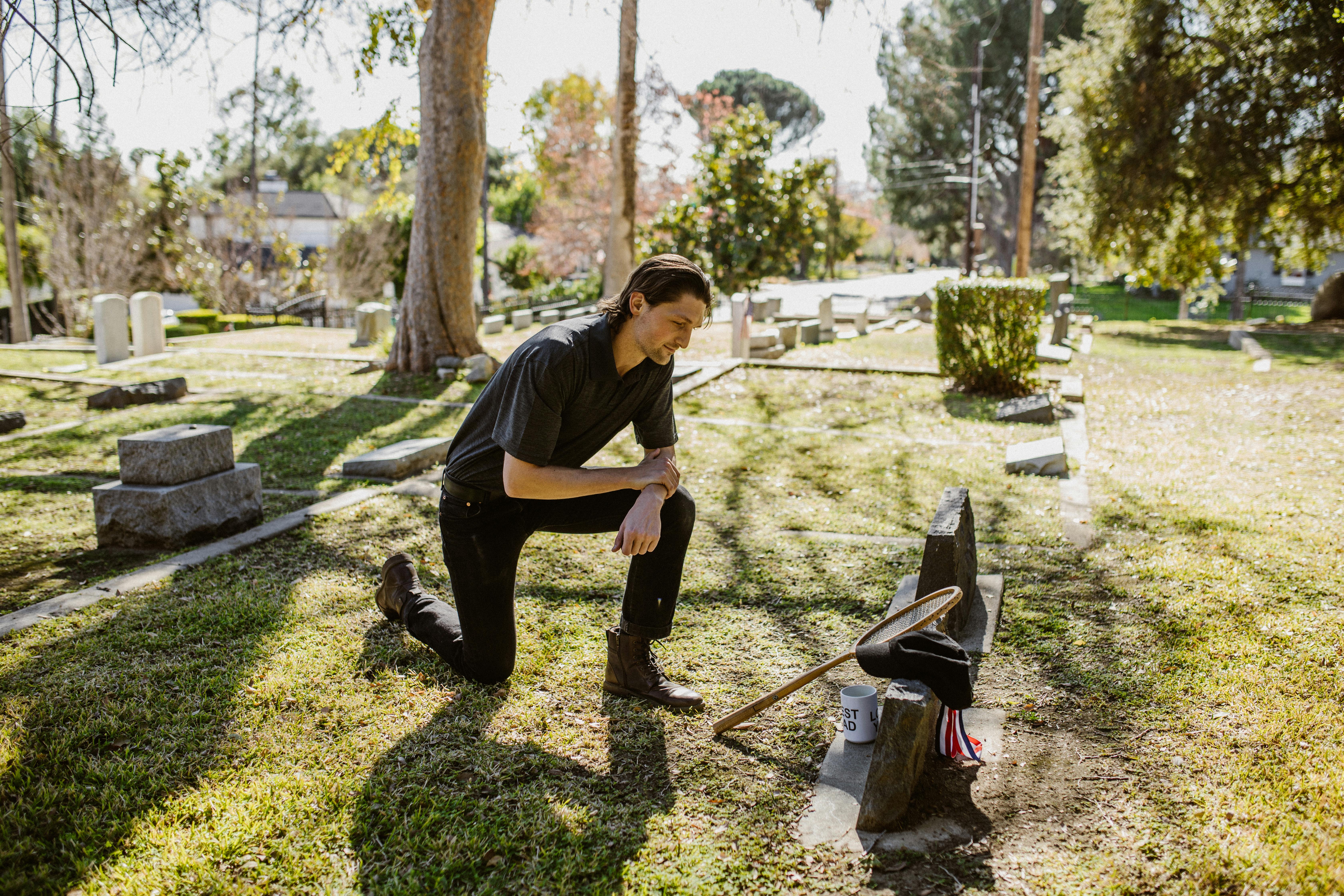 Man visiting a Grave of a Beloved · Free Stock Photo