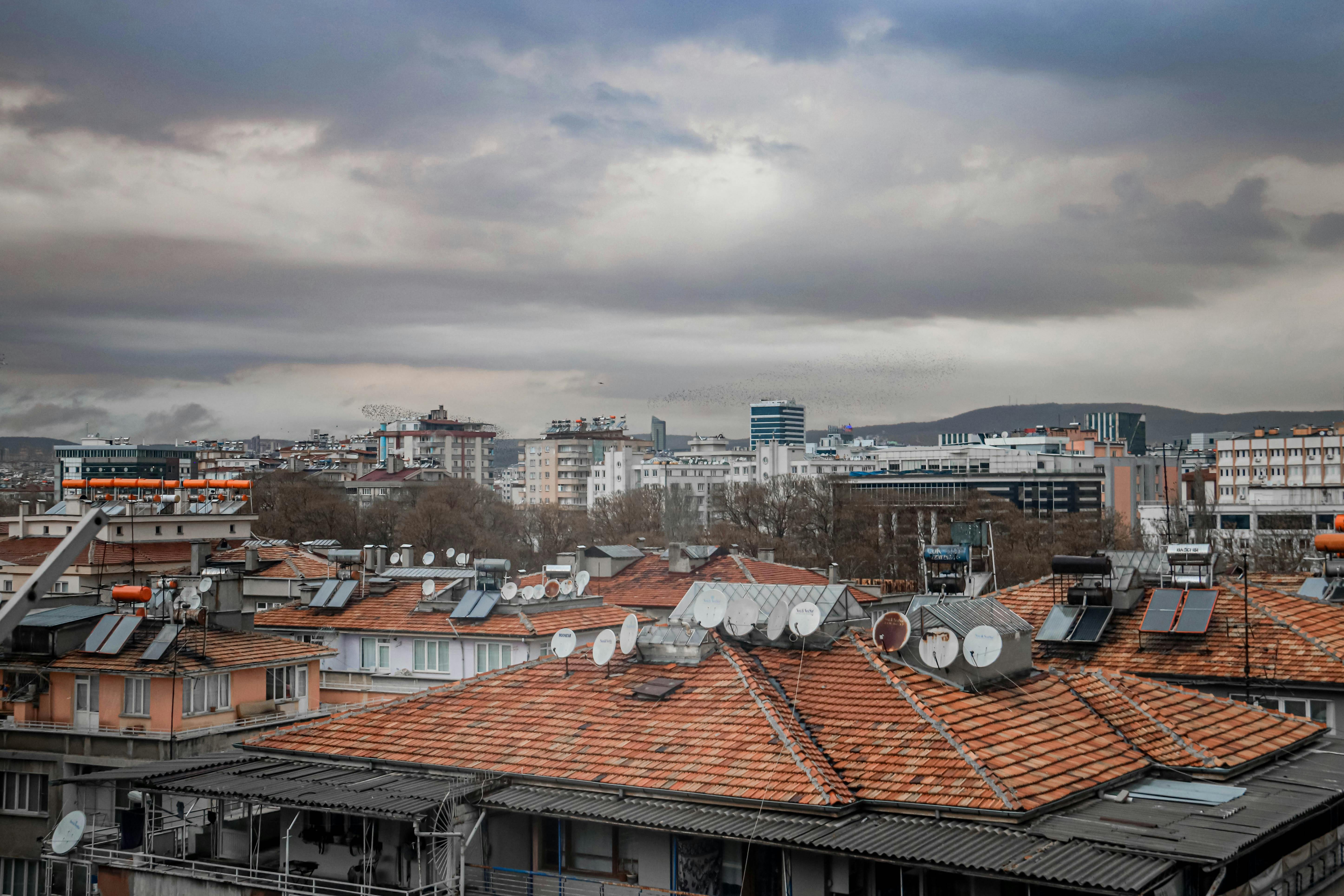 City Buildings under Cloudy Sky · Free Stock Photo