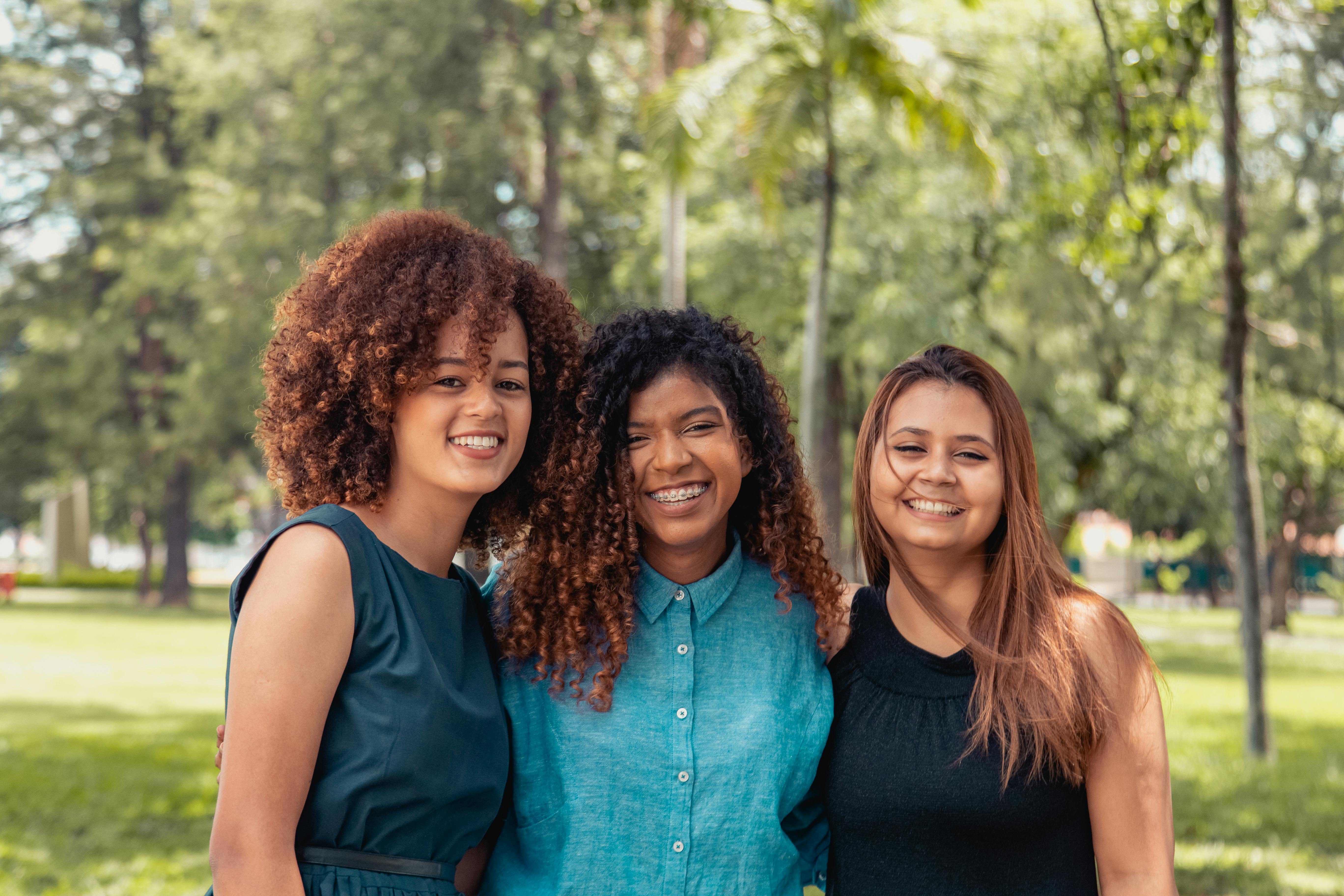 2 Person Holding Each Other Wearing Pink Friendship Bracelet during ...