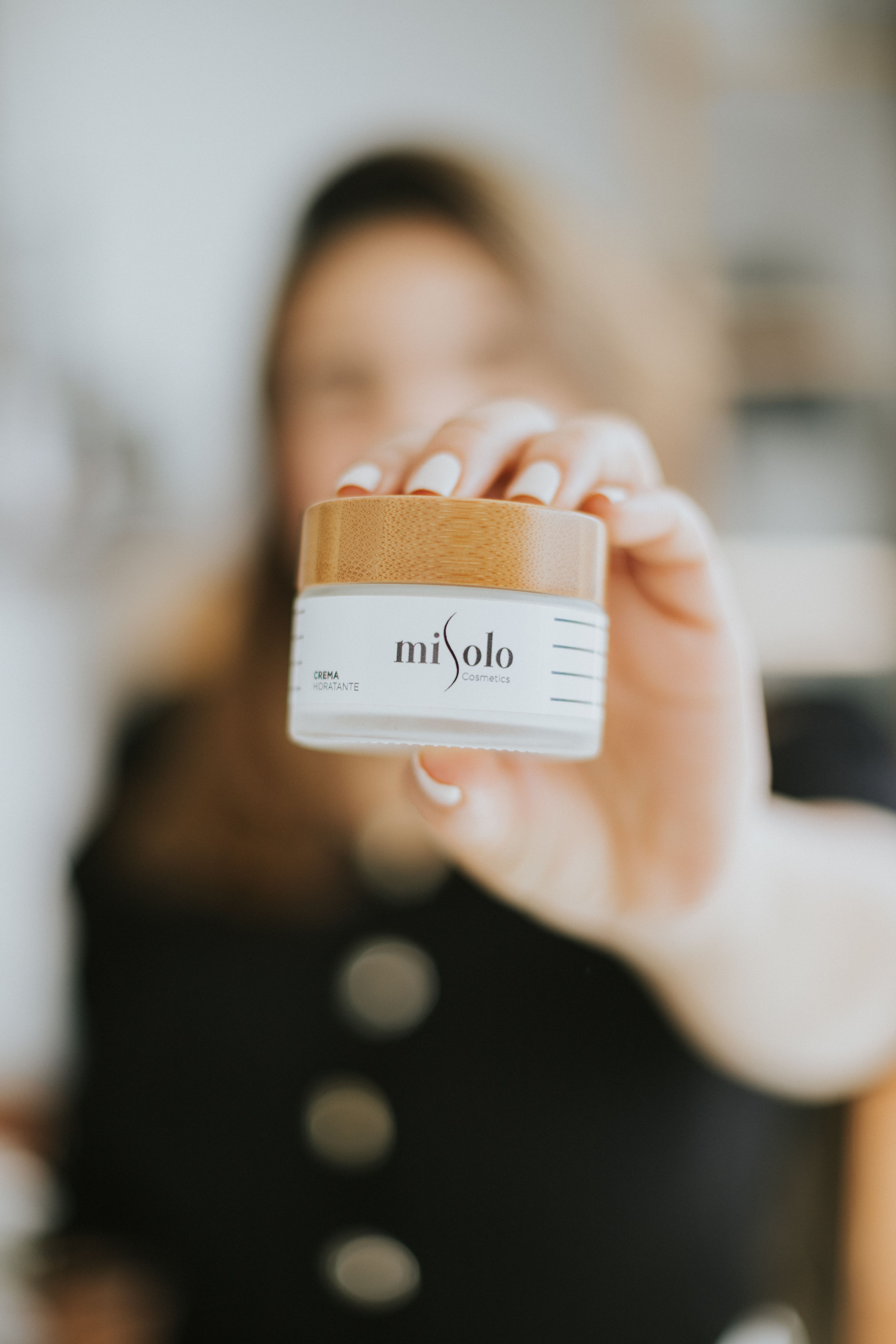 Close-up of Hand Holding Beauty Products · Free Stock Photo