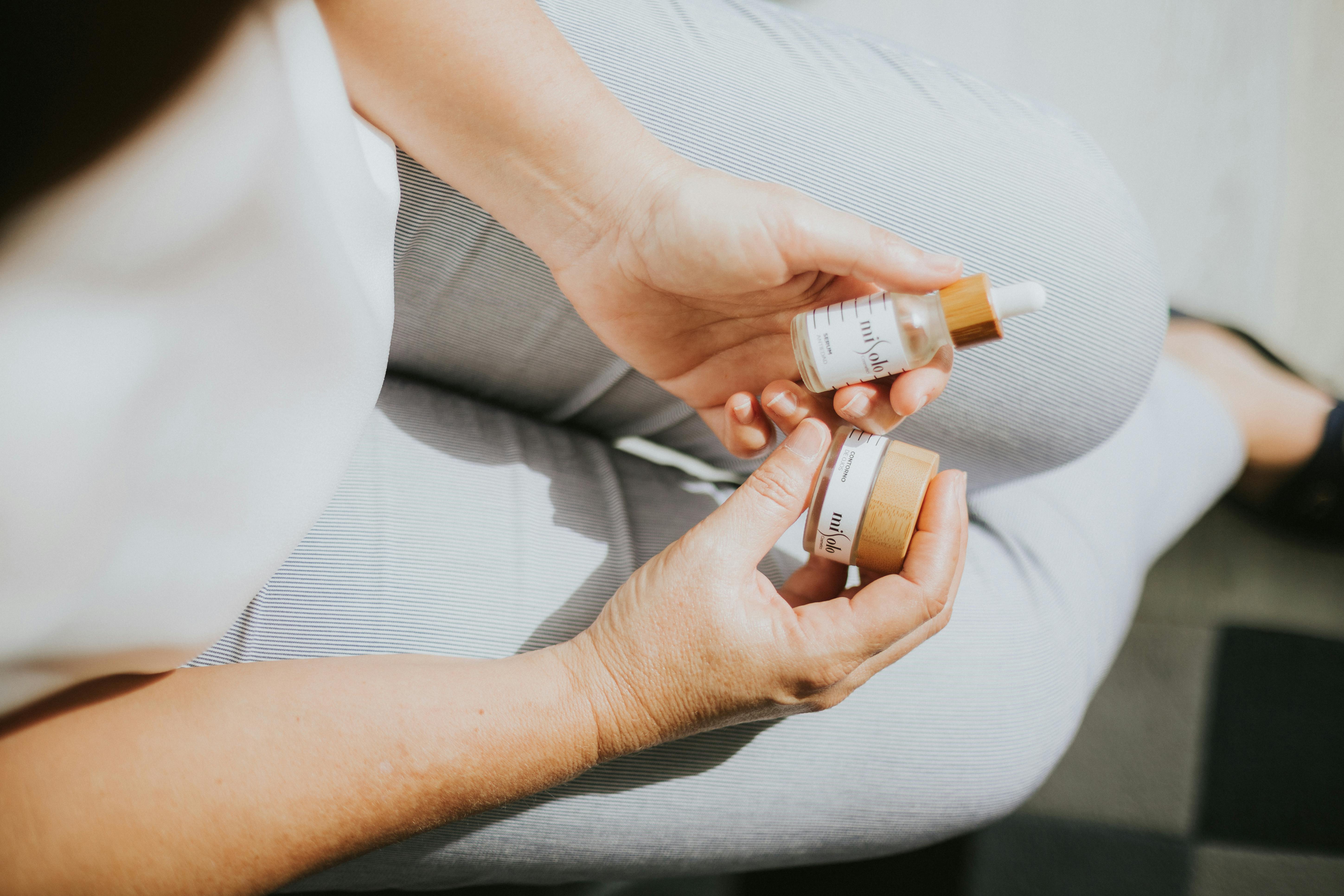 Person Holding A Dropper With Liquid · Free Stock Photo