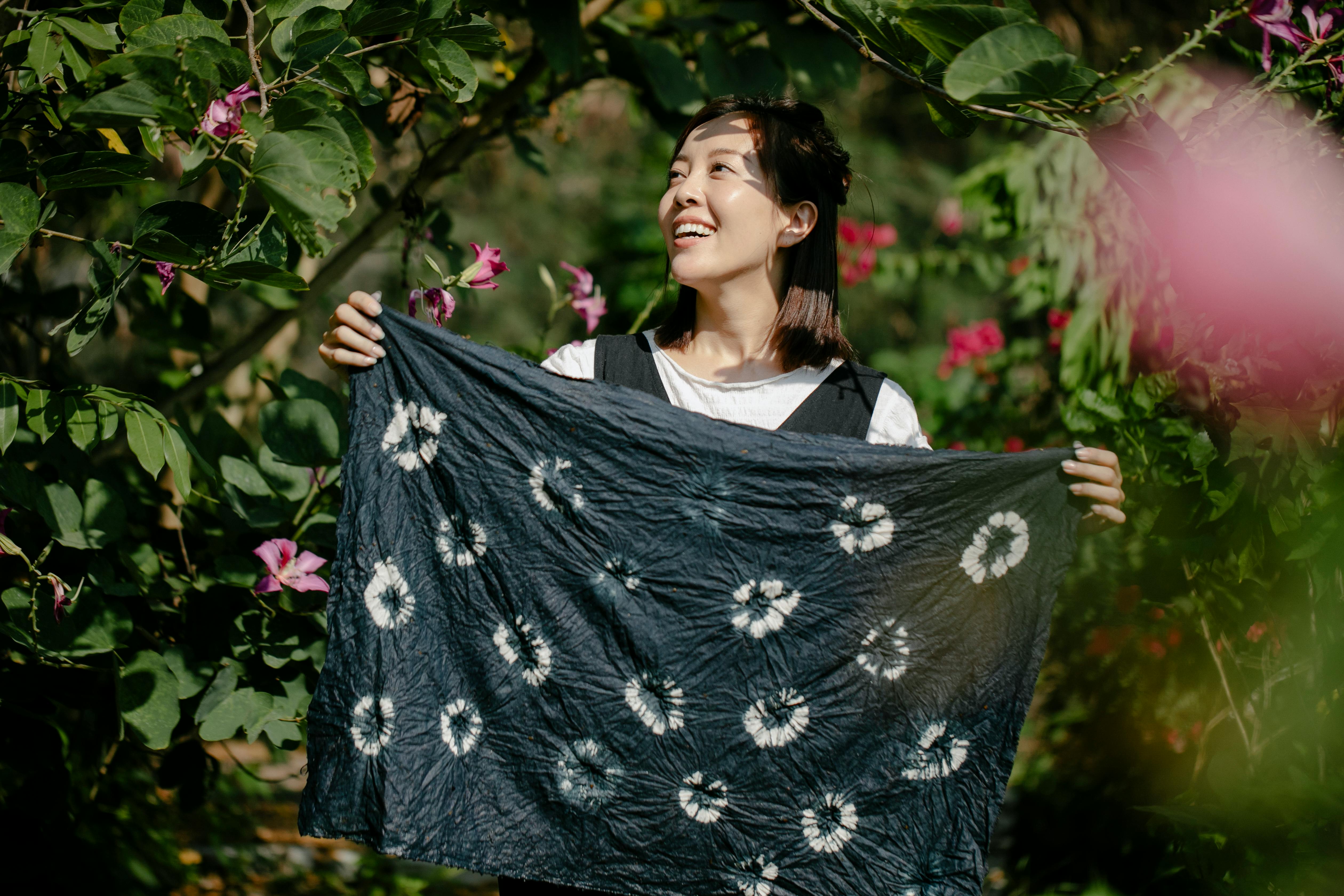 Portrait of a Woman Holding a Cloth · Free Stock Photo