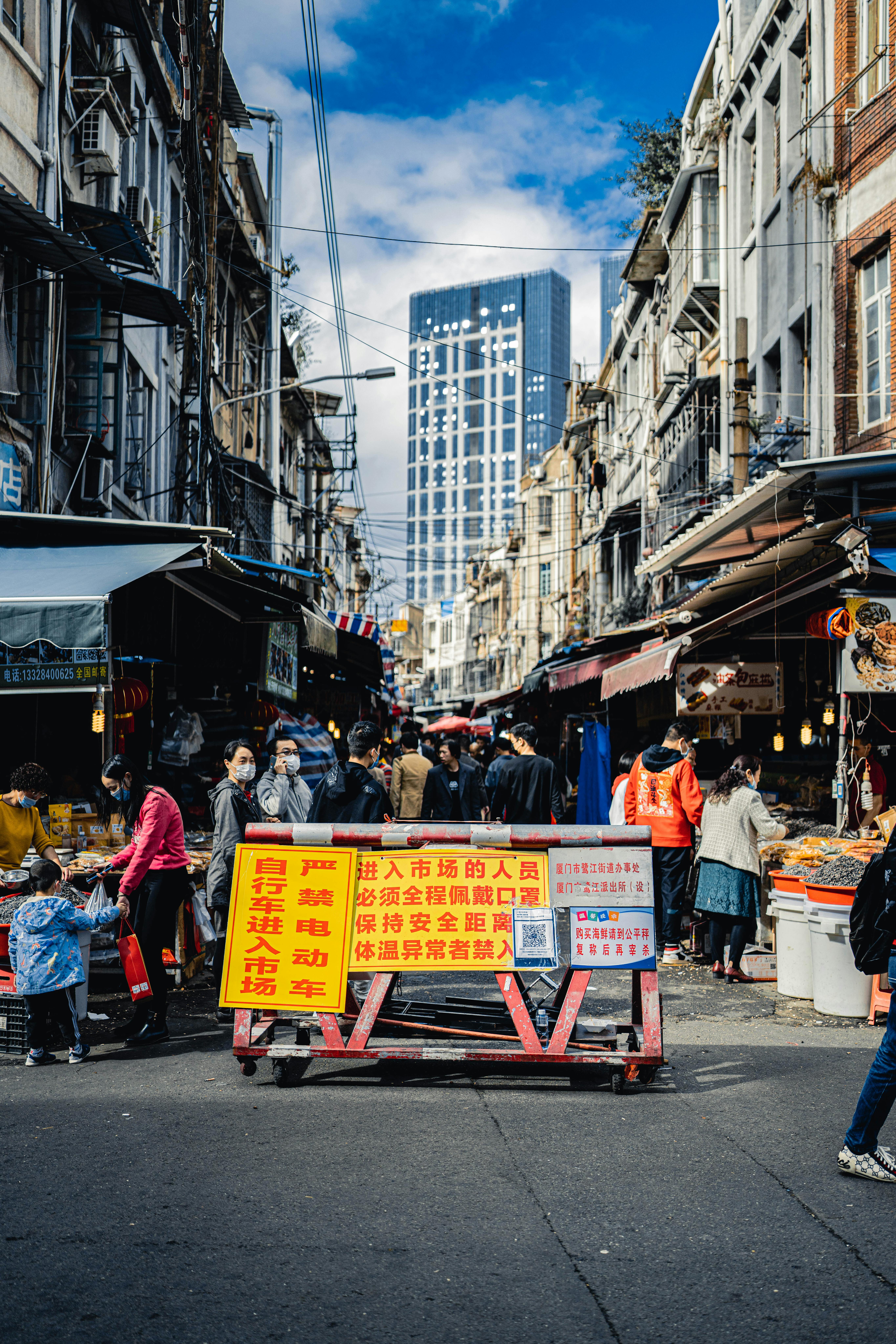 Crowded street with houses and signboards · Free Stock Photo