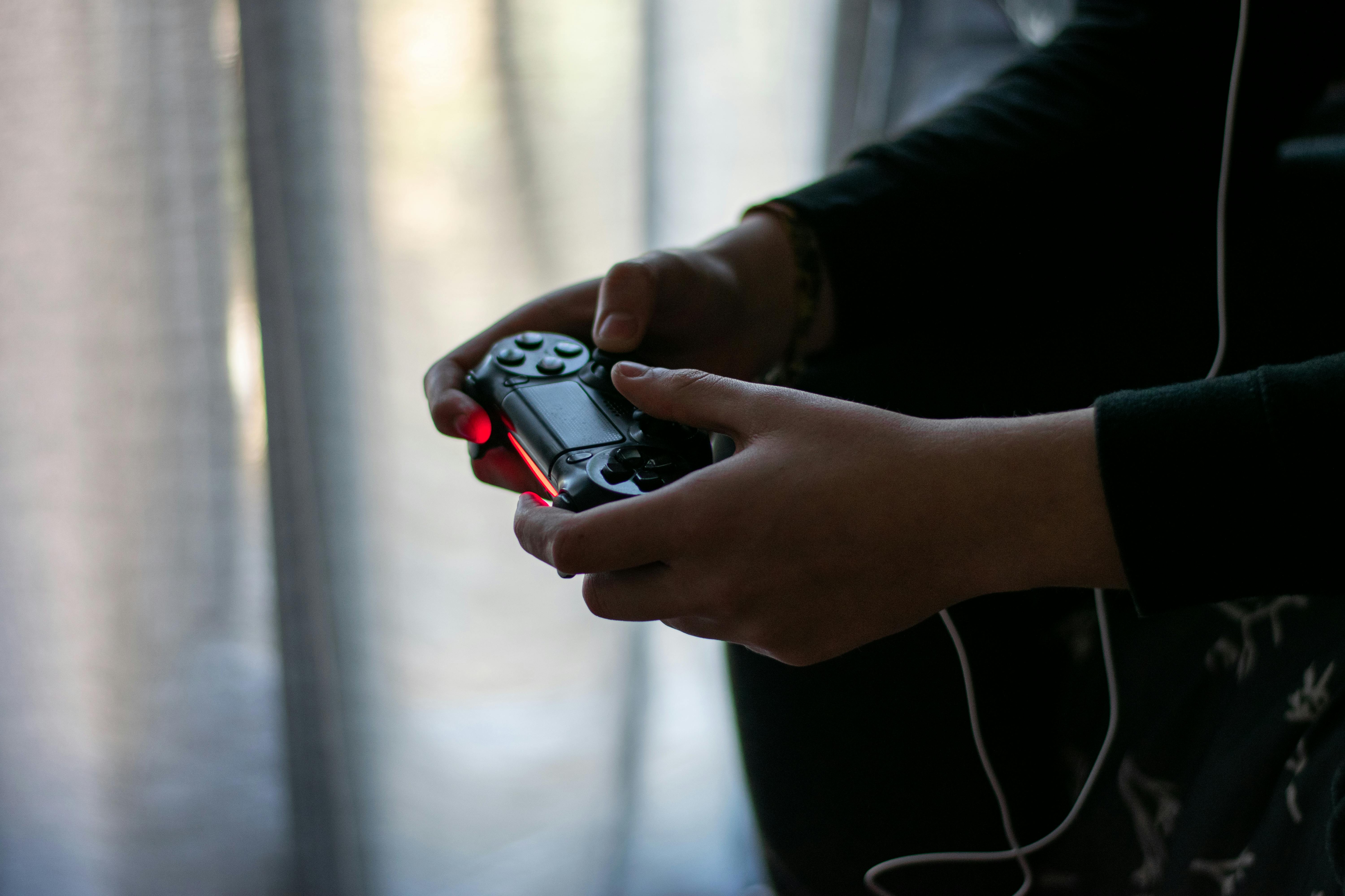 Close-Up Shot of Person Holding a Game Controller · Free Stock Photo