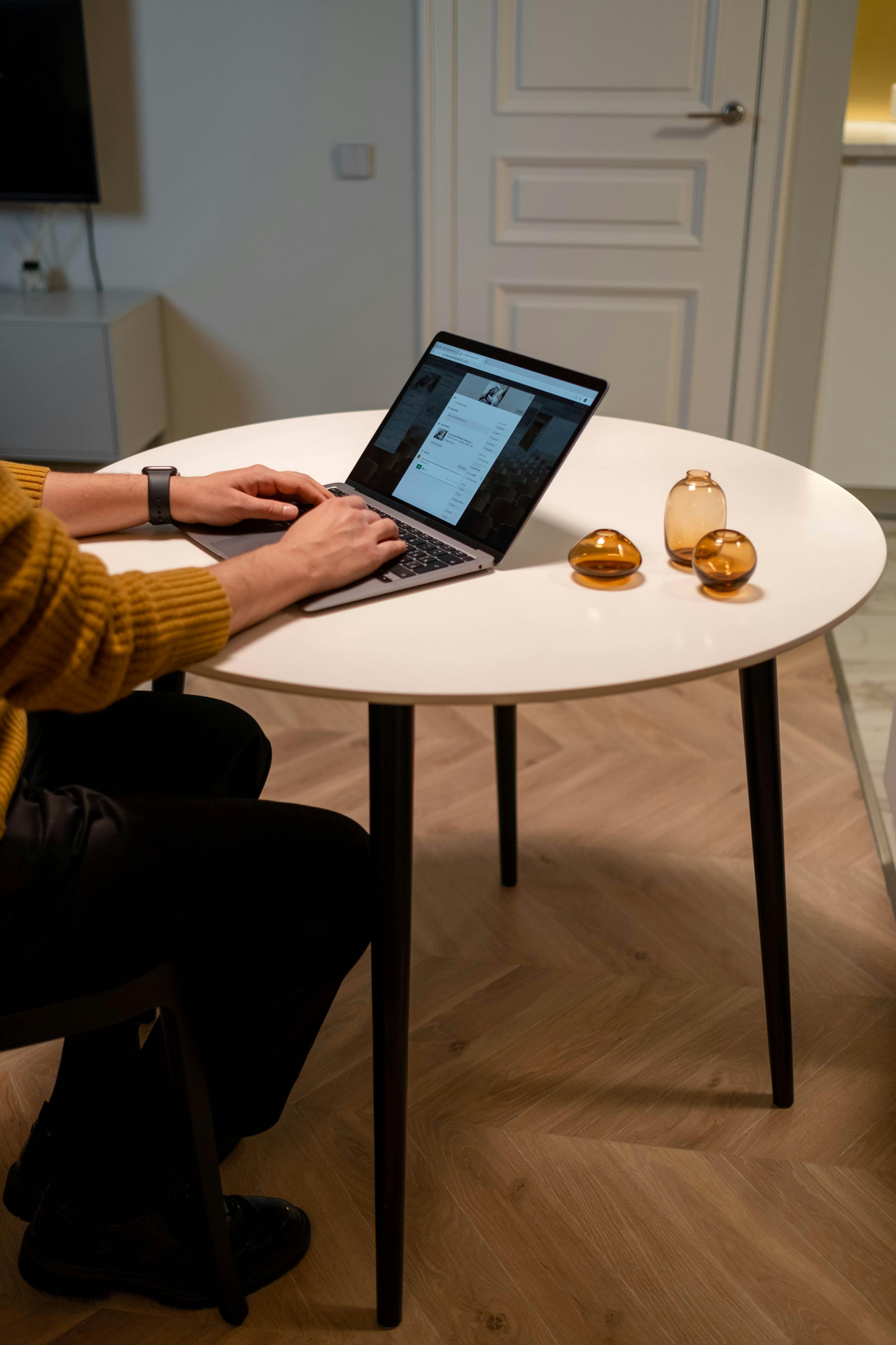 Person Using Macbook Pro with Google Website on Screen · Free Stock Photo