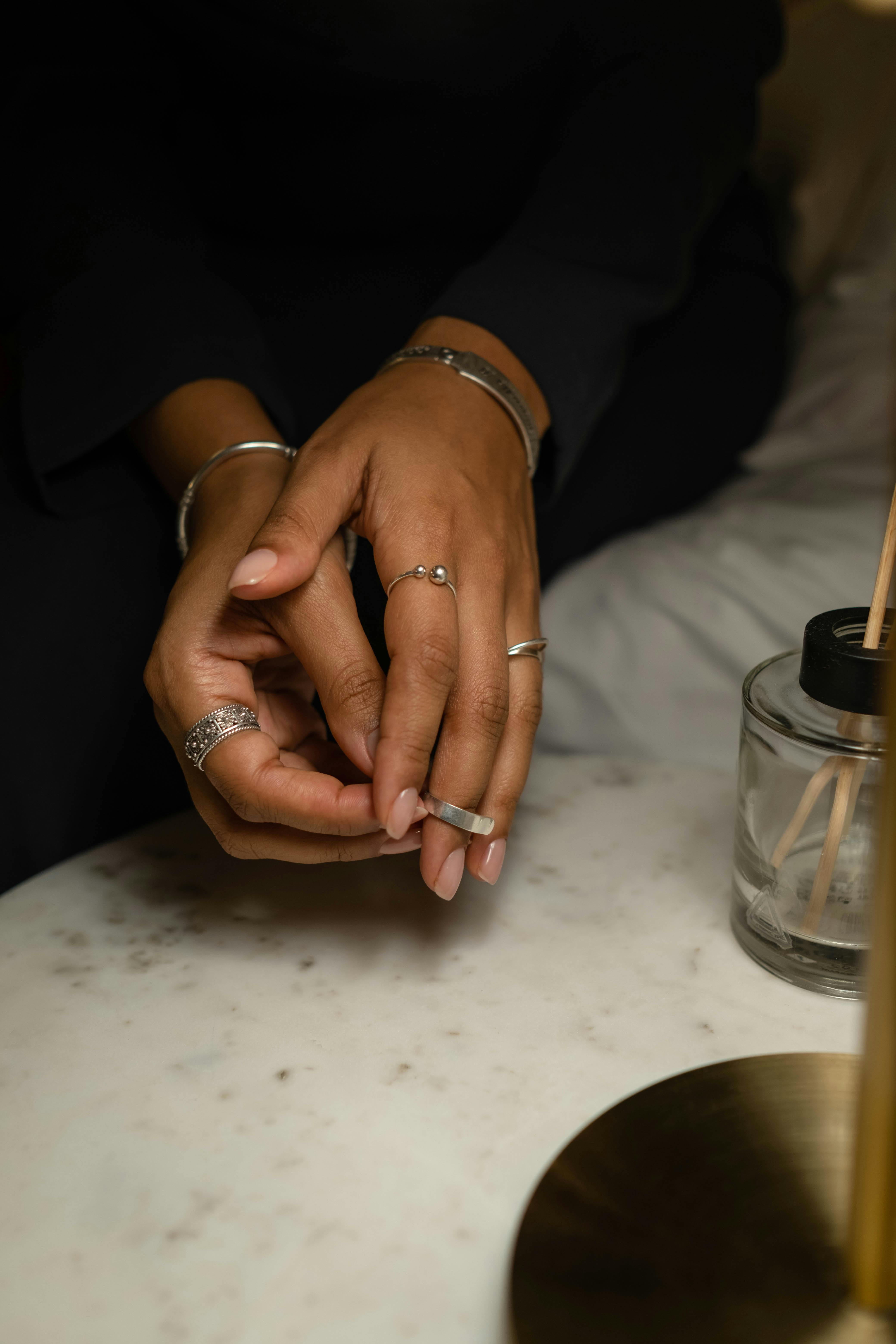 Person Wearing Silver Rings · Free Stock Photo