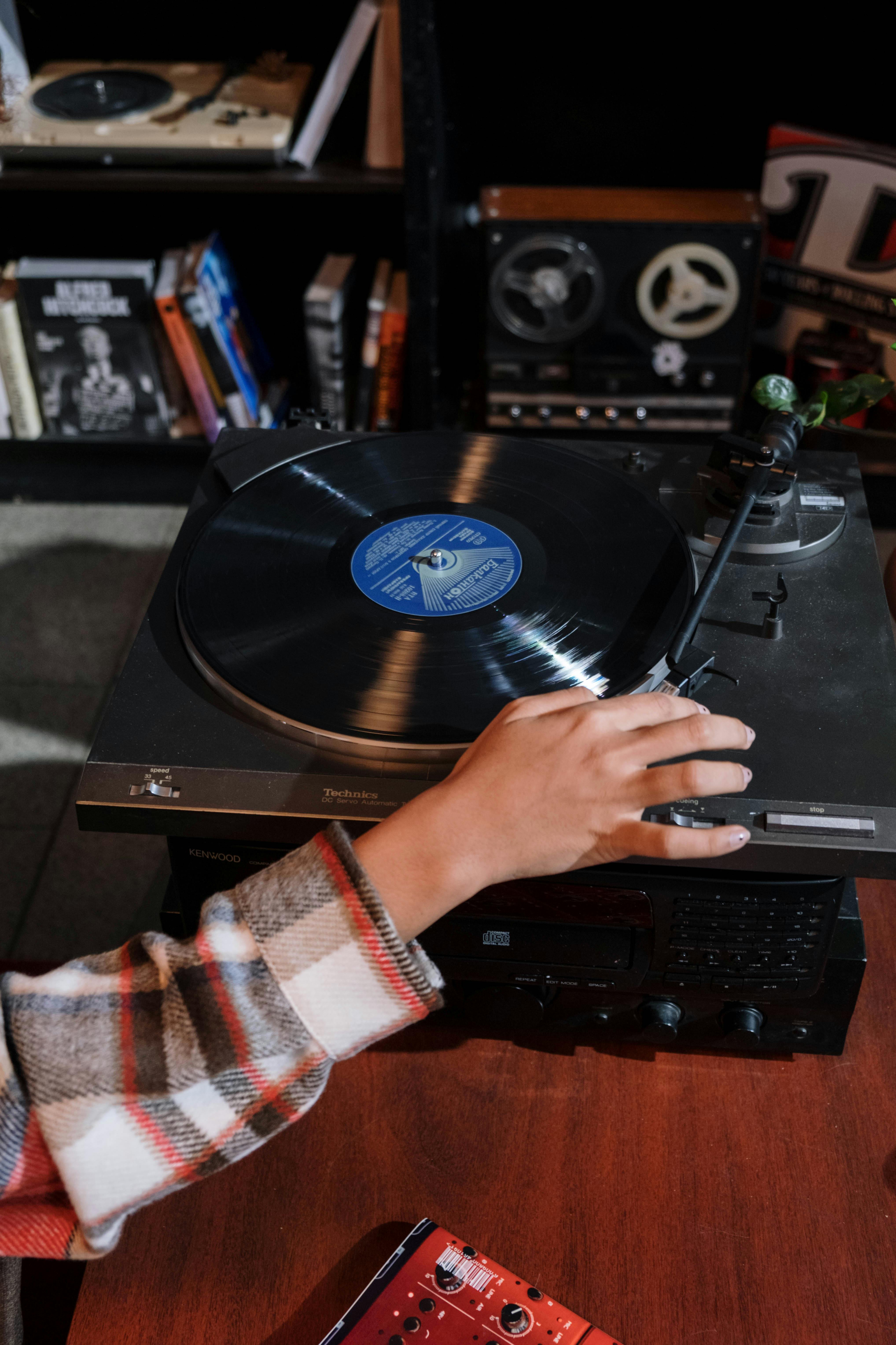 A Person Using a Turntable · Free Stock Photo
