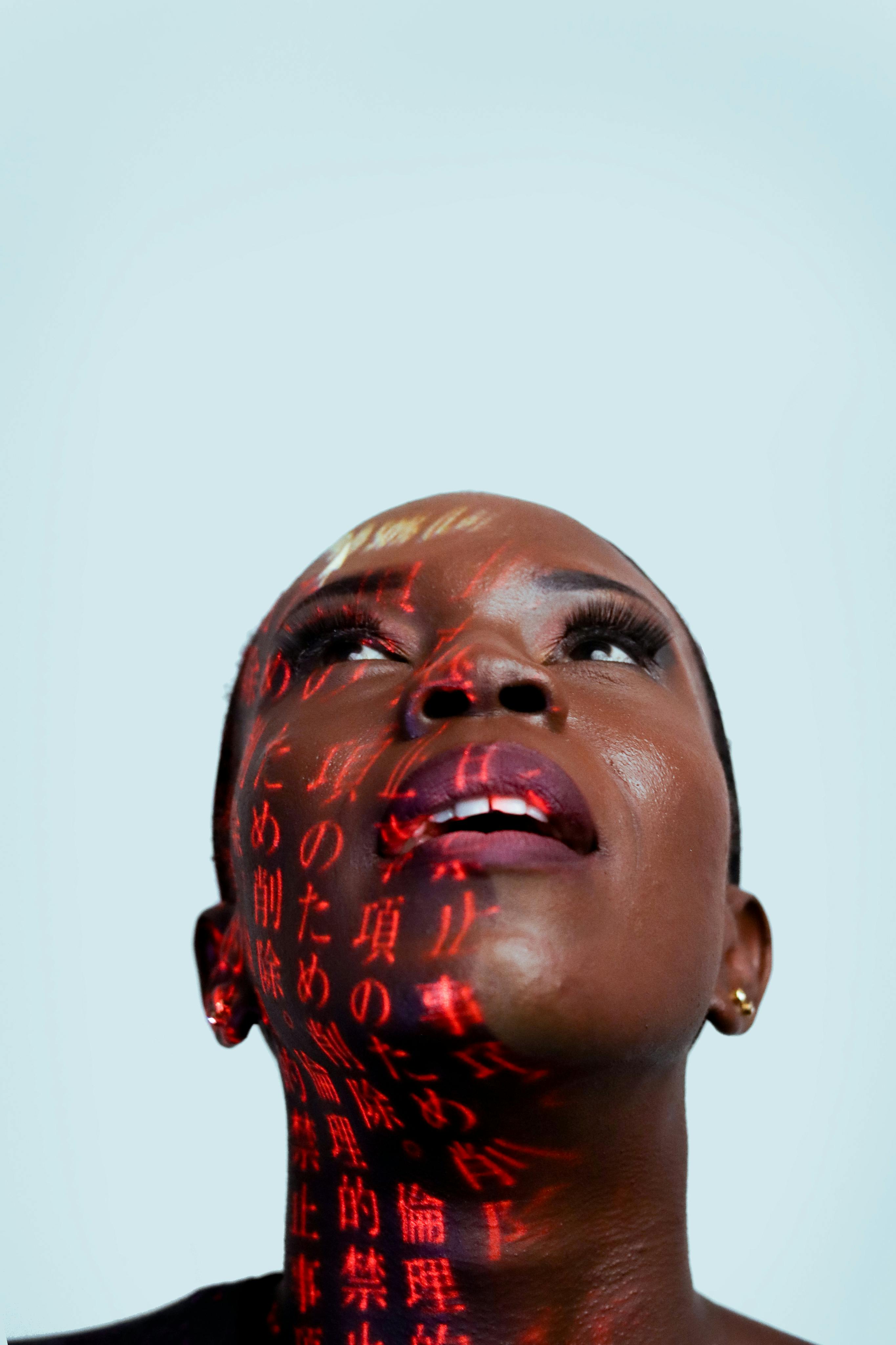 Portrait of a Woman with Text on Her Face · Free Stock Photo