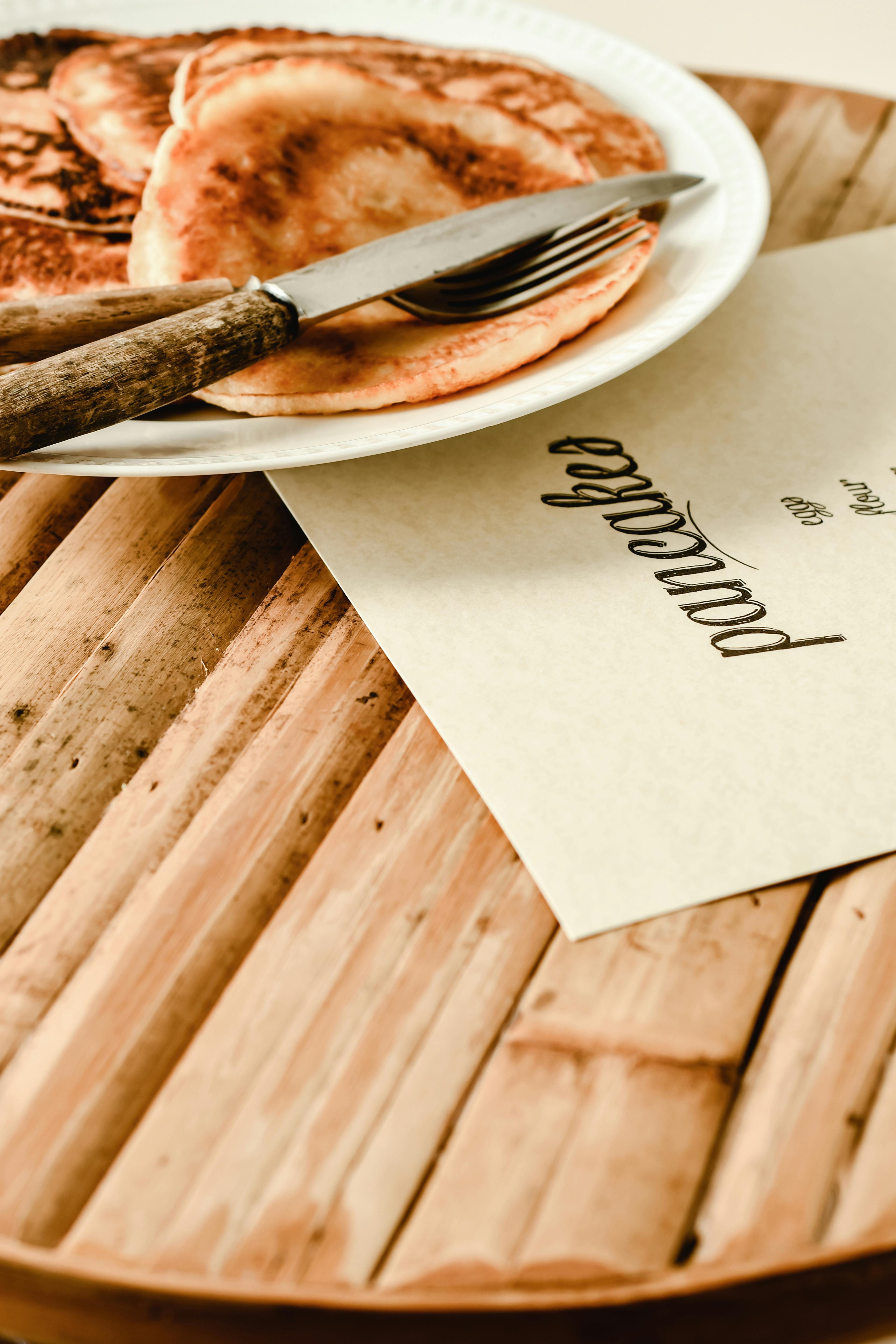 Pancakes on a Wooden Table Top · Free Stock Photo