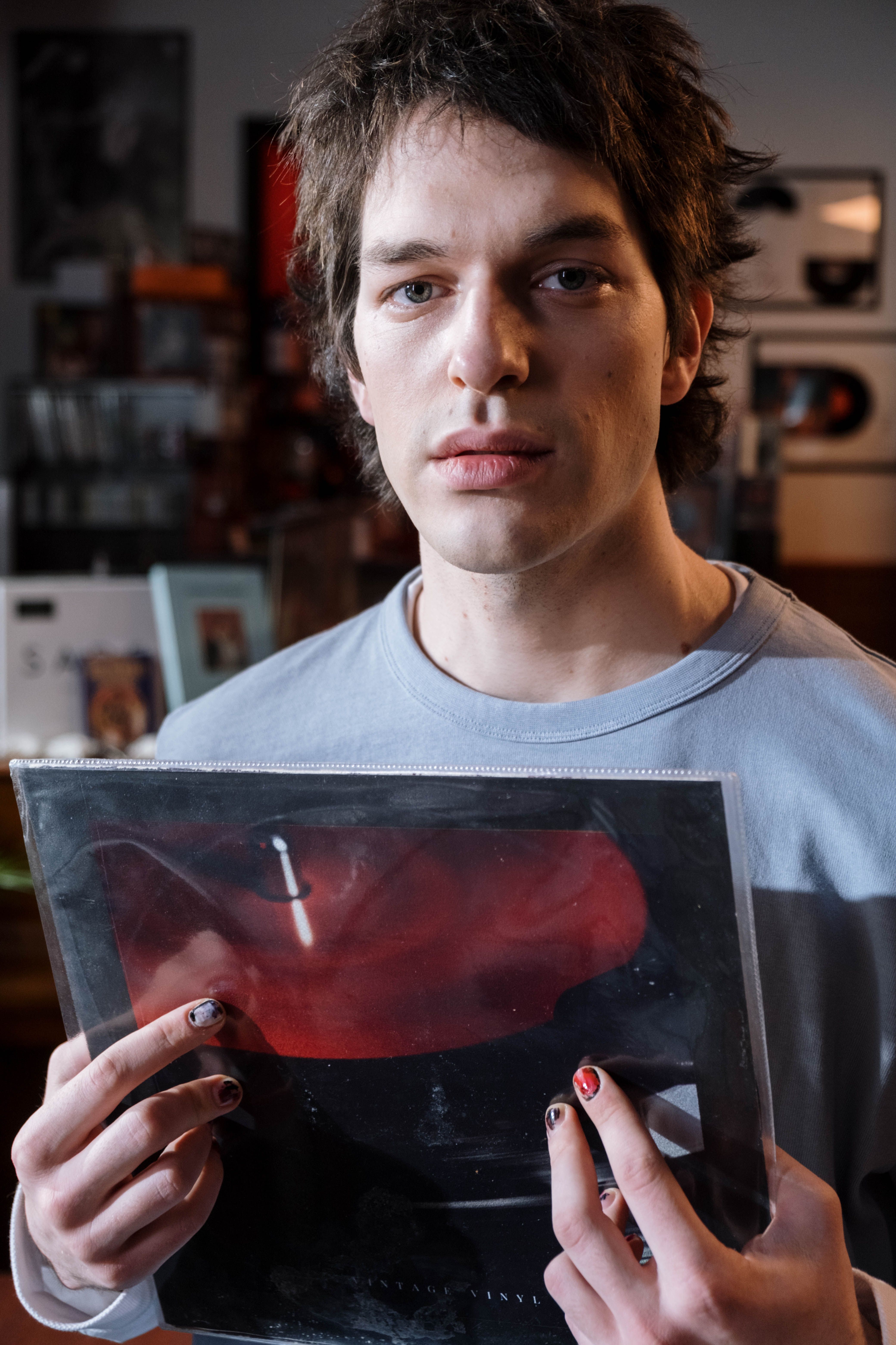 A Man Holding a Vinyl Record · Free Stock Photo