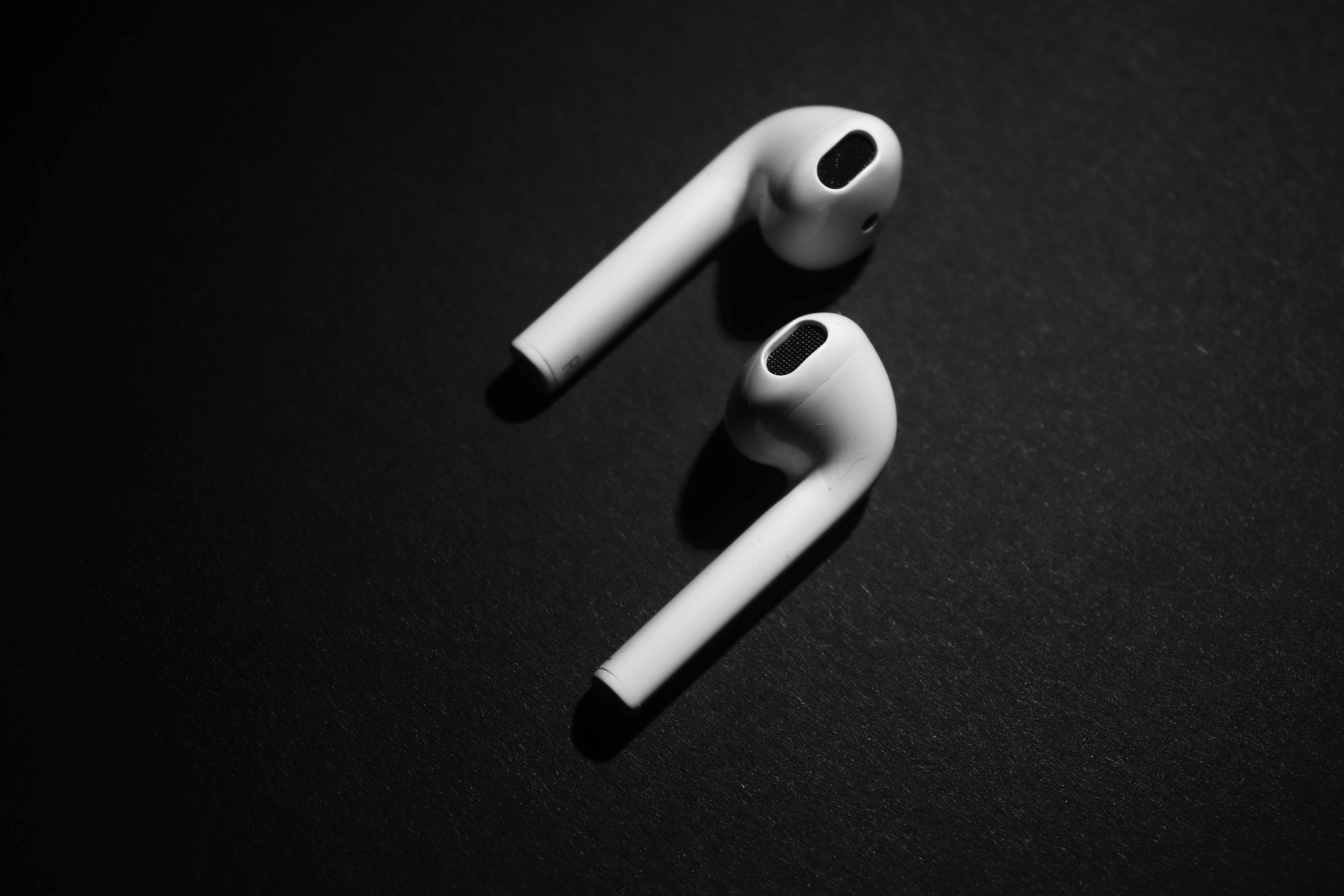 White Earpods on Black Background · Free Stock Photo