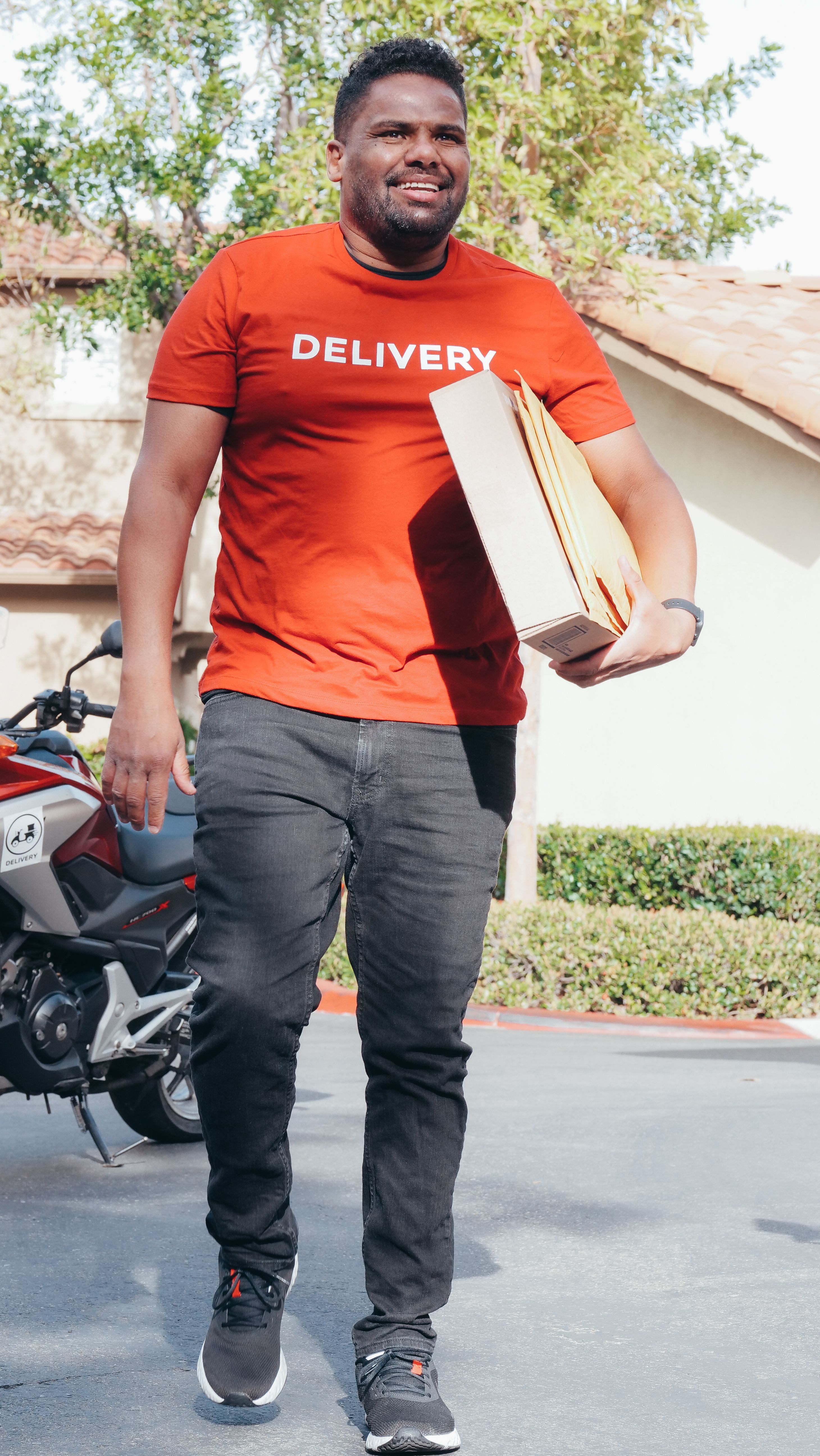 A Woman Receiving a Package · Free Stock Photo