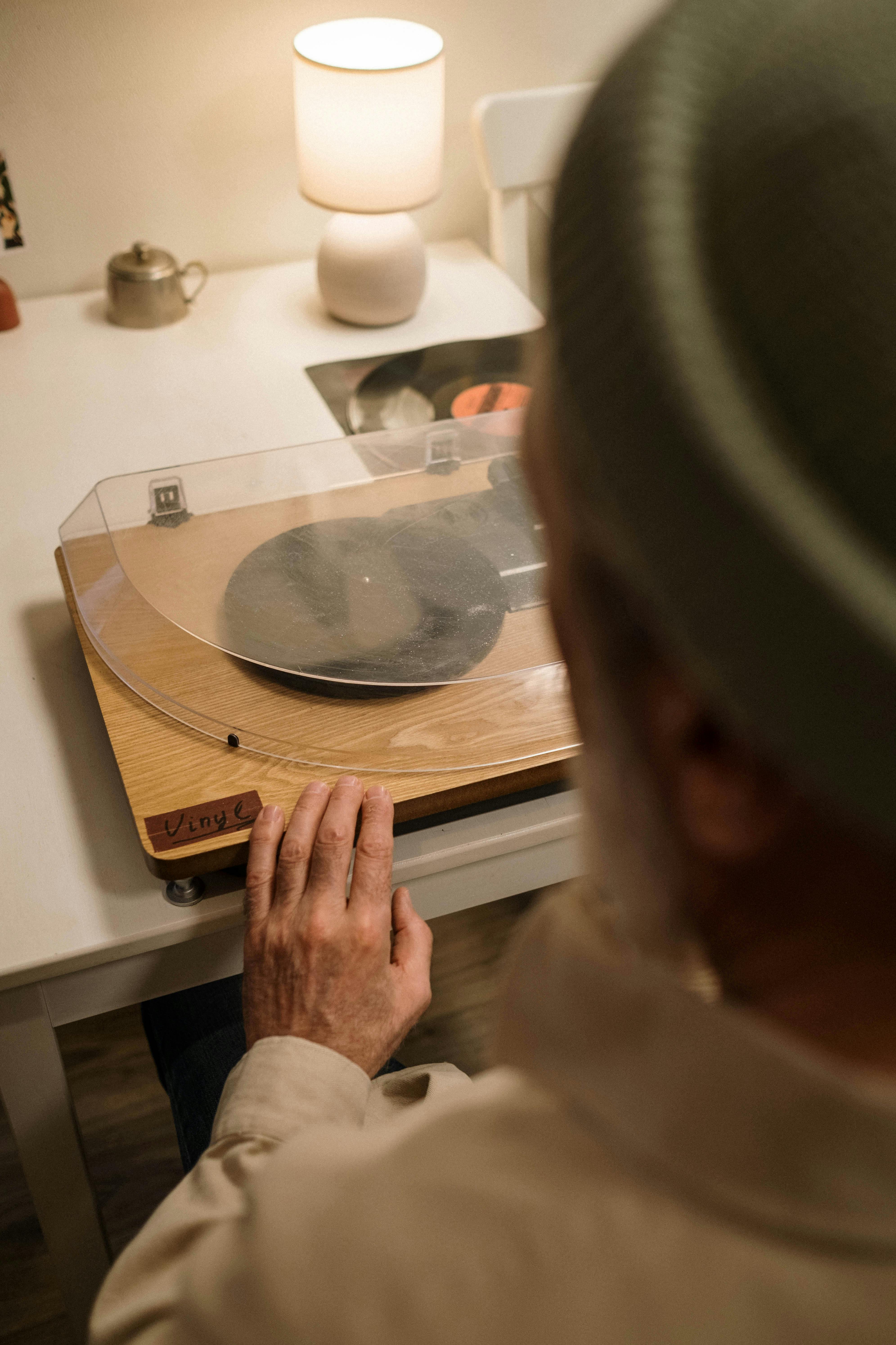 A Woman Beside a Turntable · Free Stock Photo
