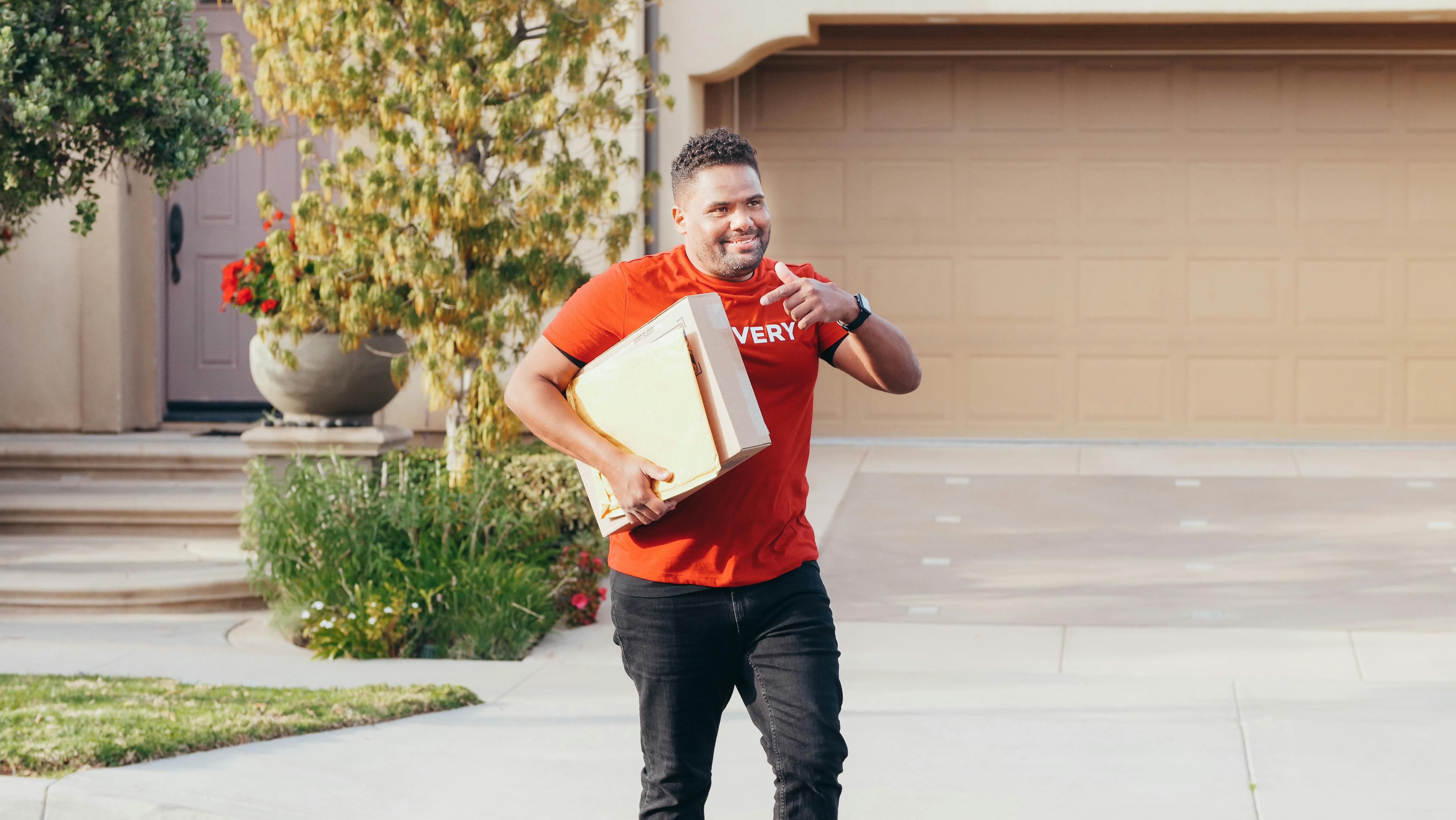 A Man Carrying a Box · Free Stock Photo