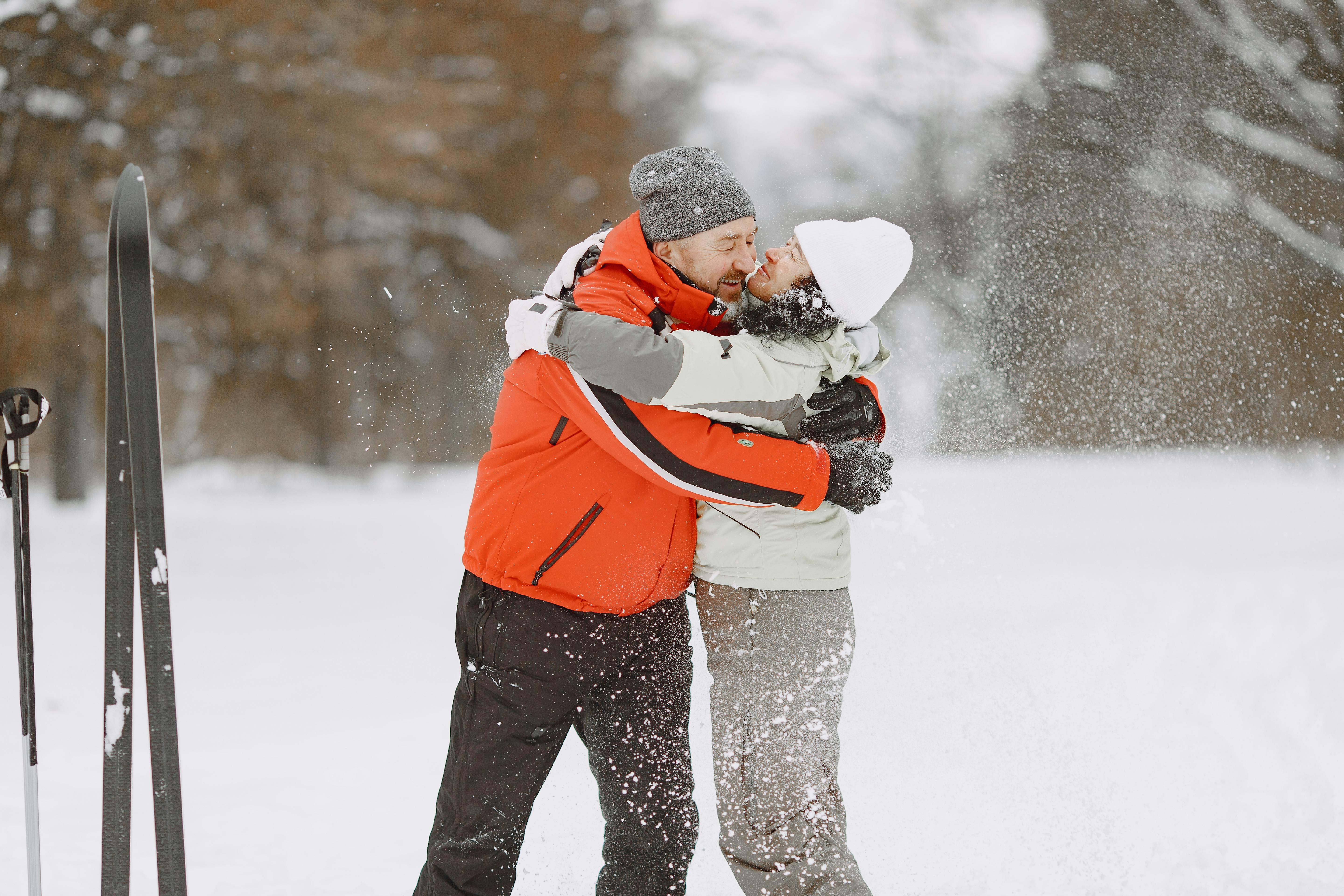 Man in Red Jacket Hugging a Woman · Free Stock Photo