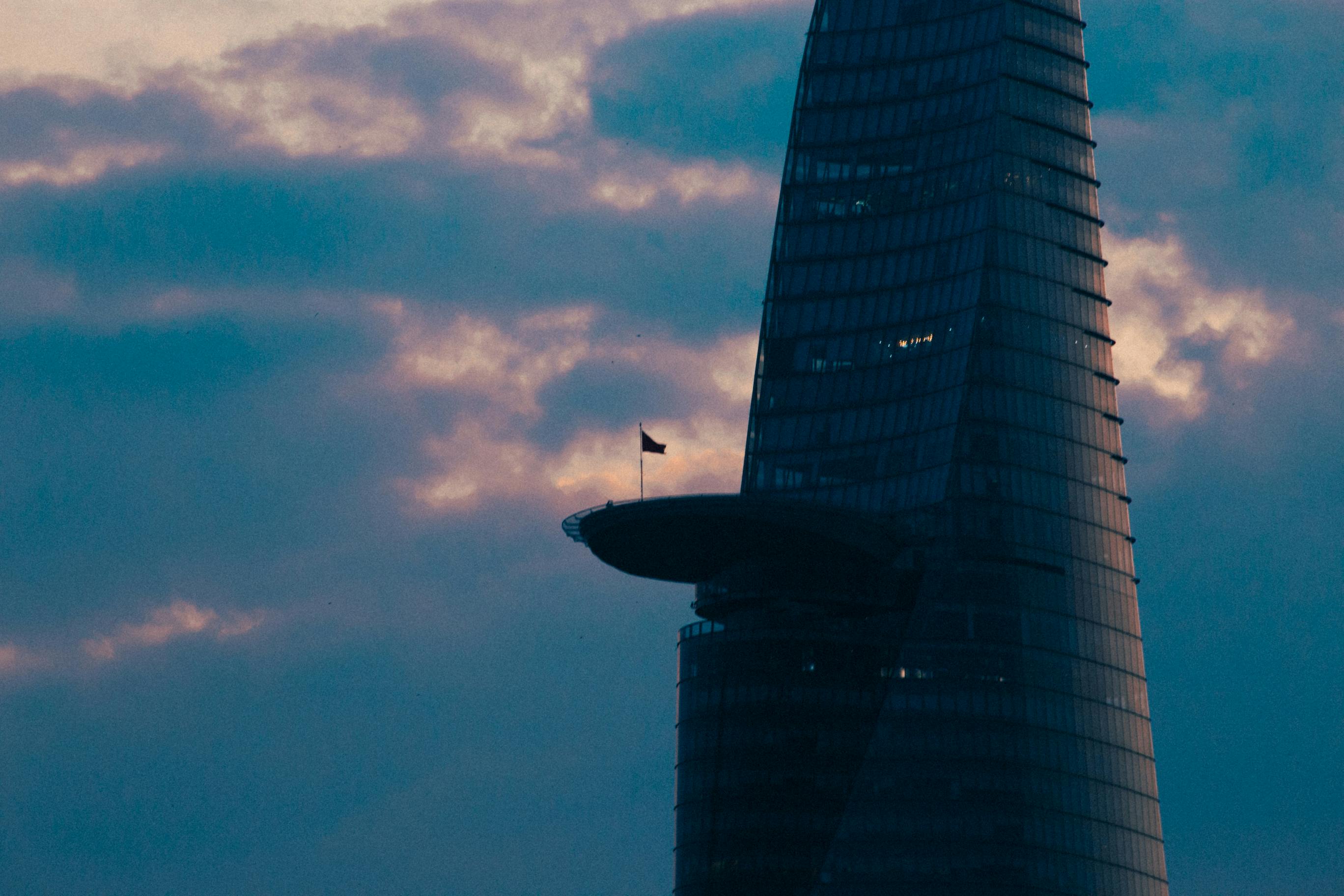 Tall Building Under Cloudy Sky · Free Stock Photo