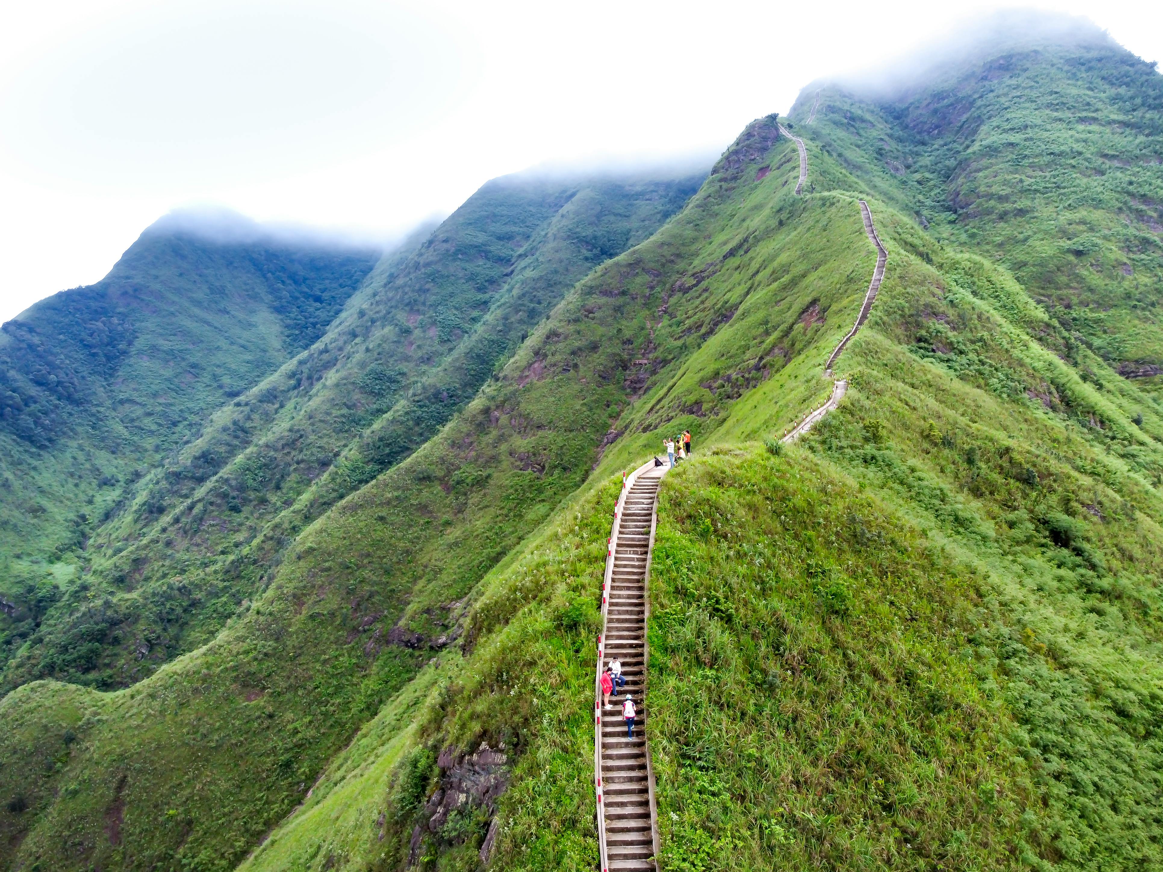Pathway on Mountain With Blue Wooden Handrails at Daytime · Free Stock ...