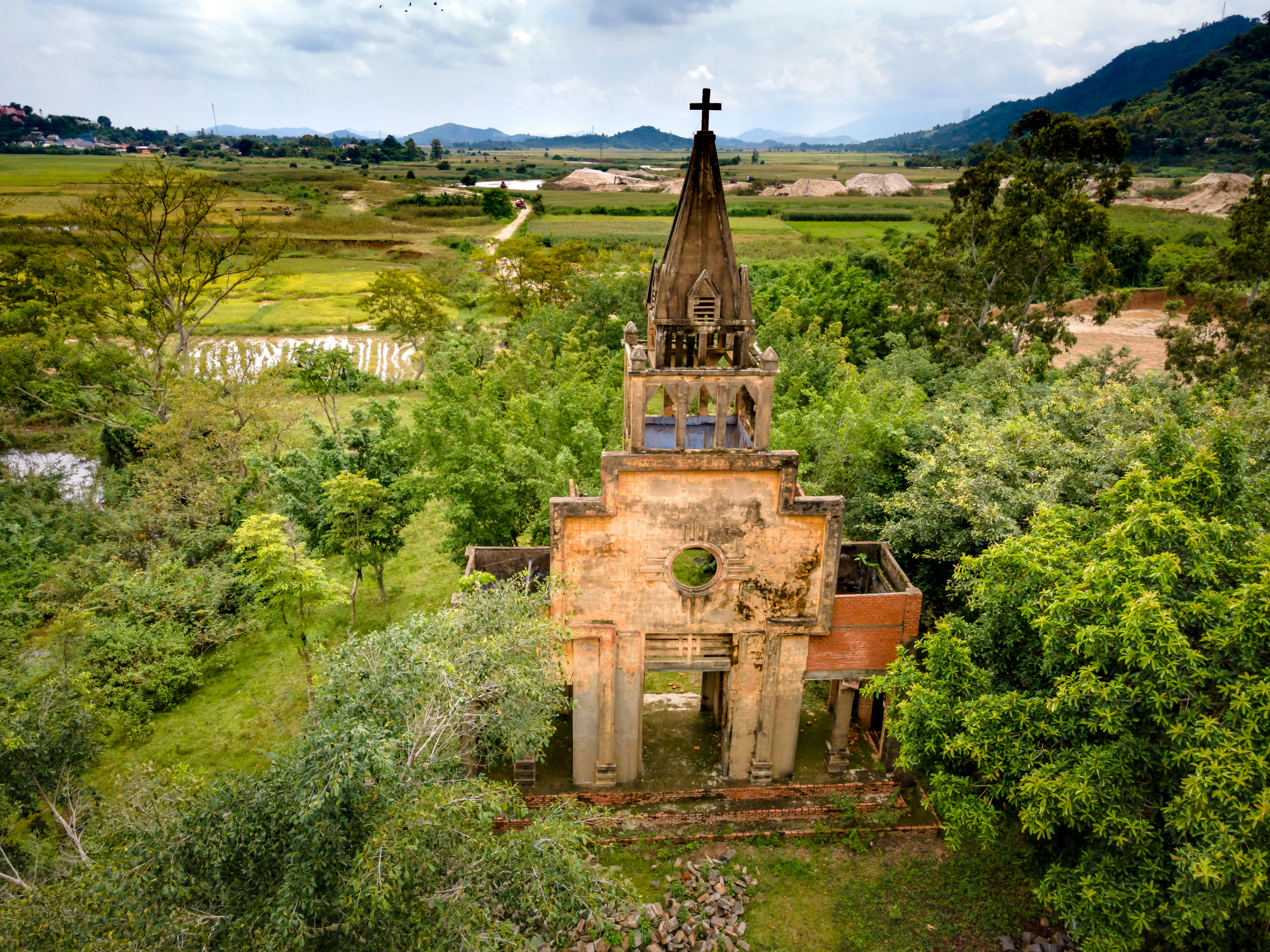 Ruins of Abandoned Church Among Trees · Free Stock Photo