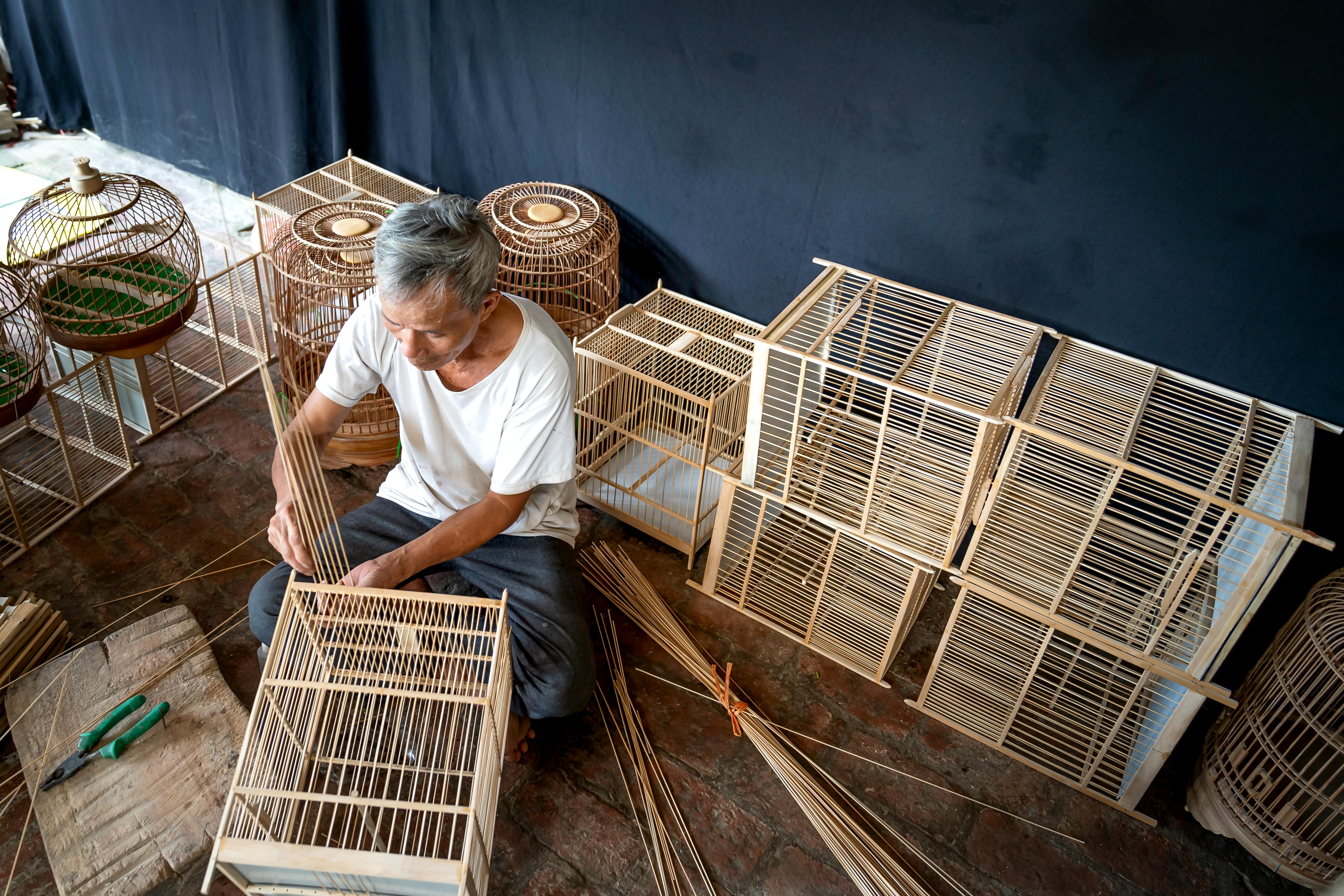 Man Making Wooden Cages · Free Stock Photo