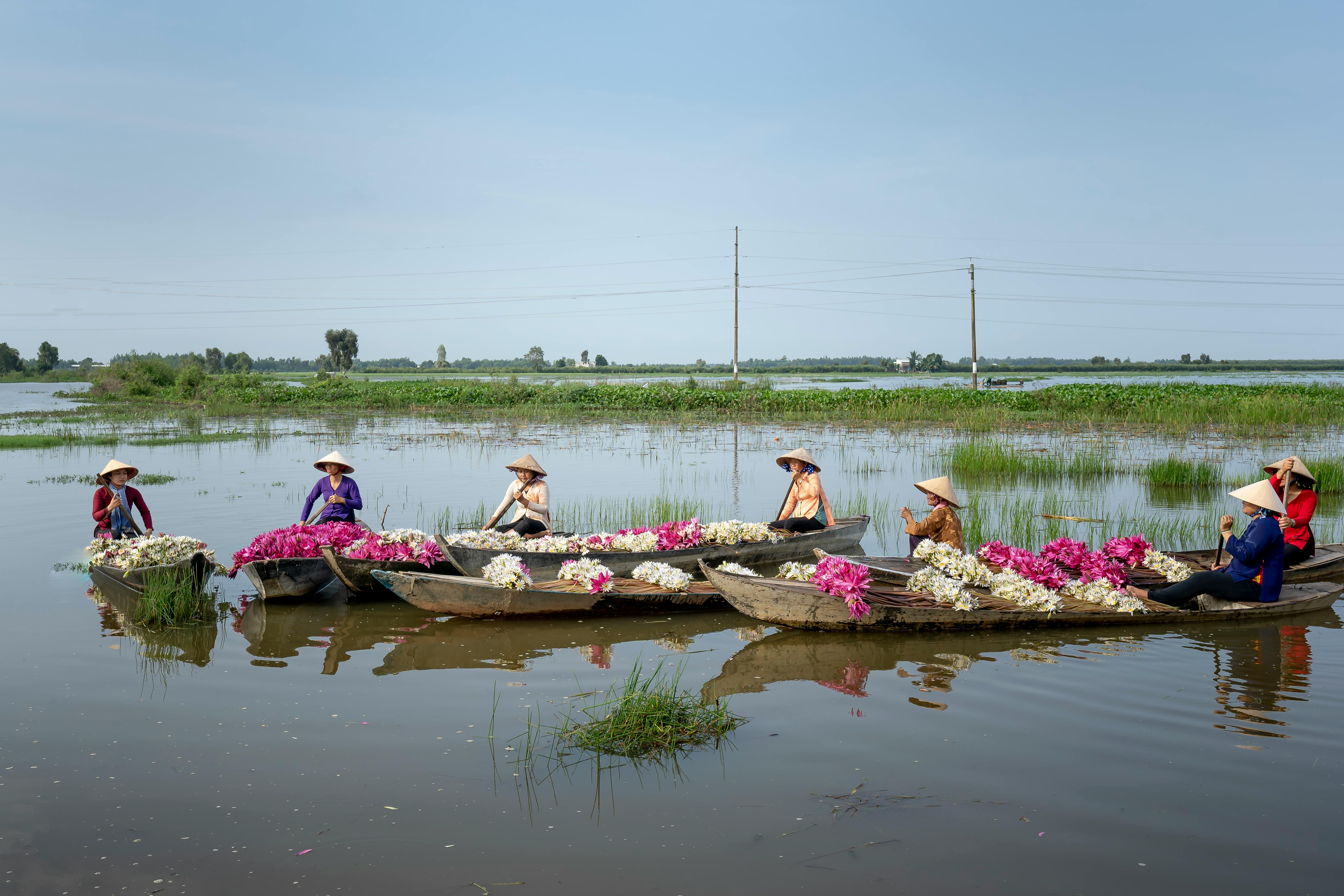 Back View of a Person Wearing Coolie Hat while Sitting on a Raft · Free ...