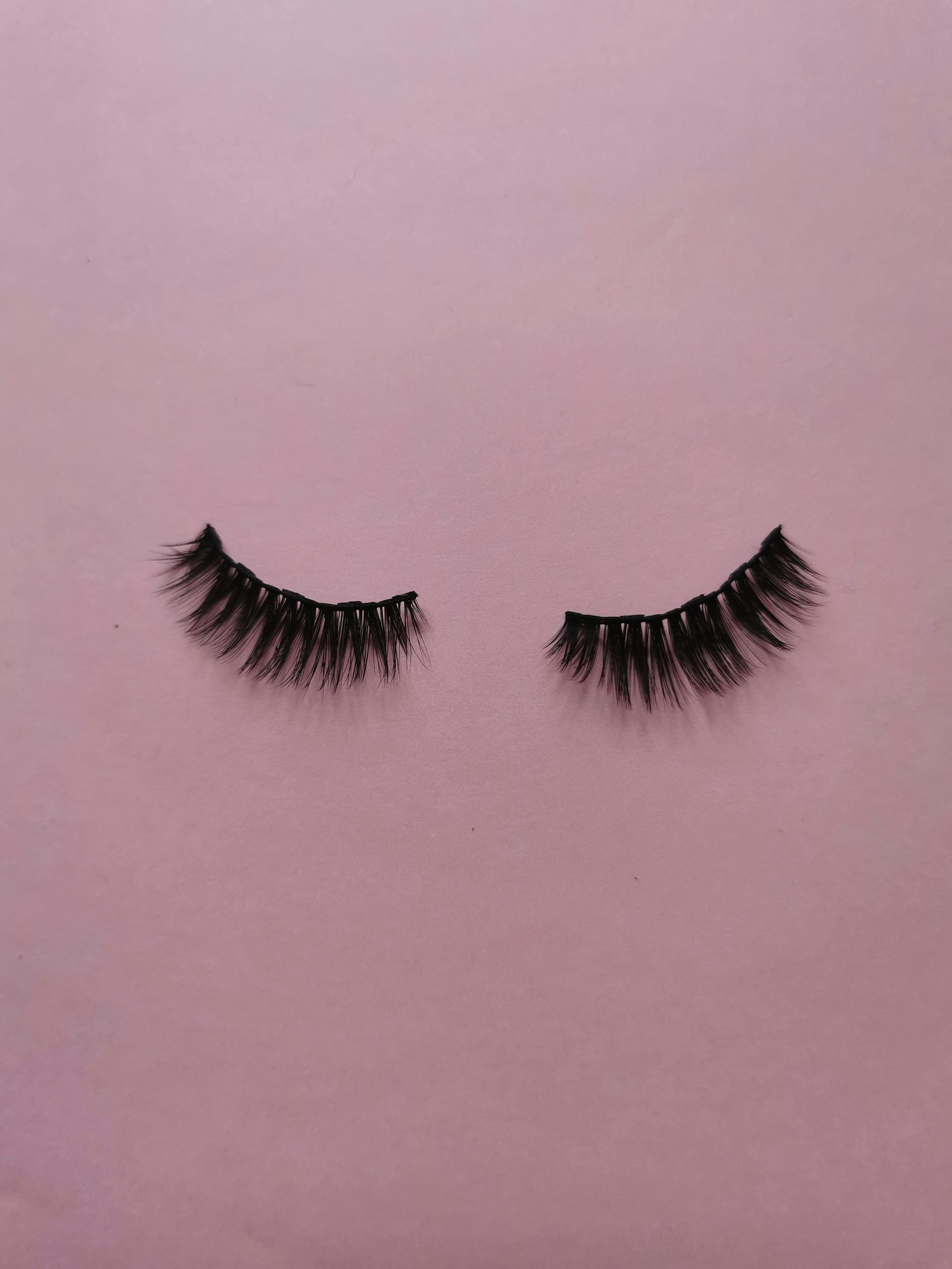Photo of Eyelashes on a Pink Surface · Free Stock Photo