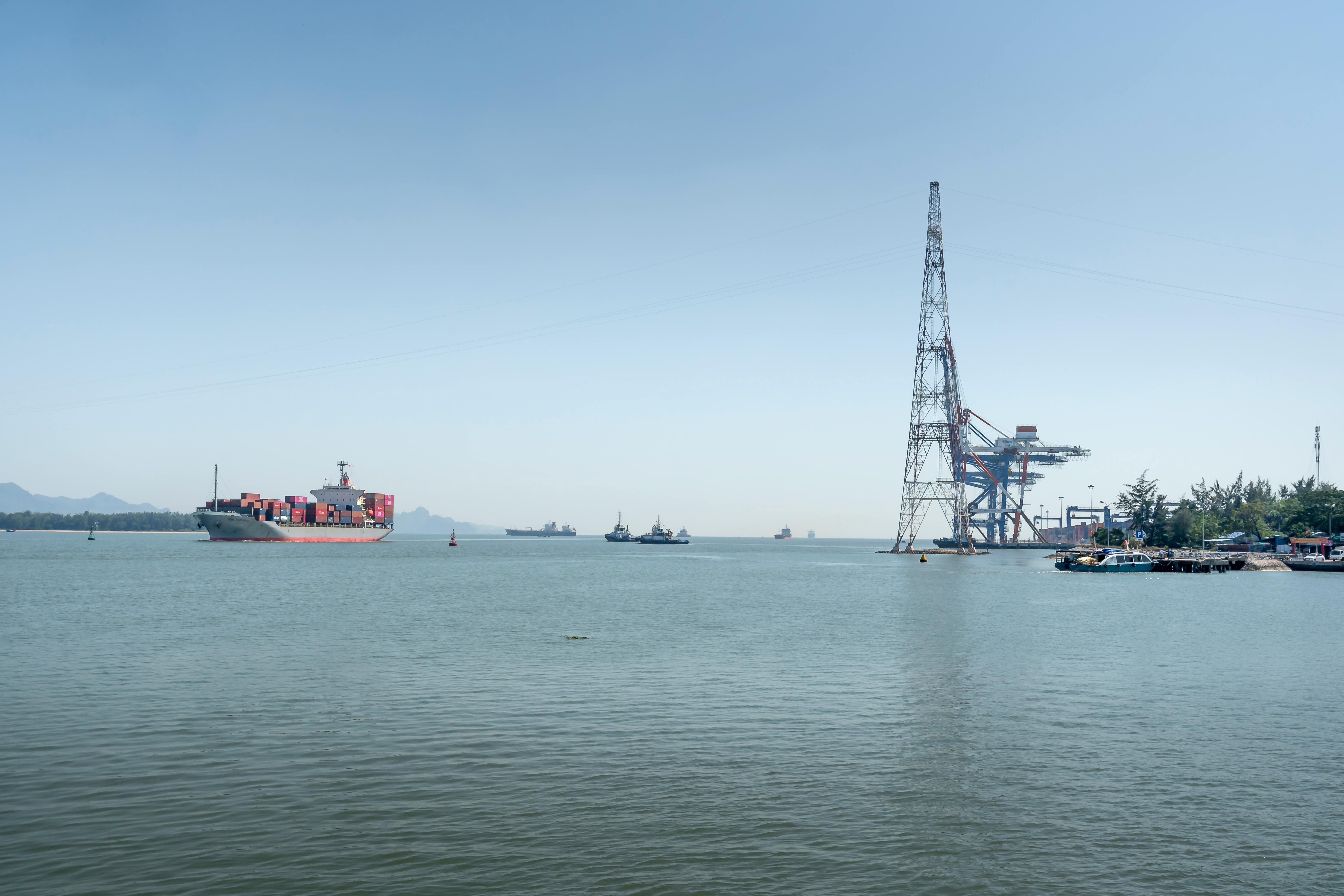 Cargo Ship in Water near Harbor · Free Stock Photo