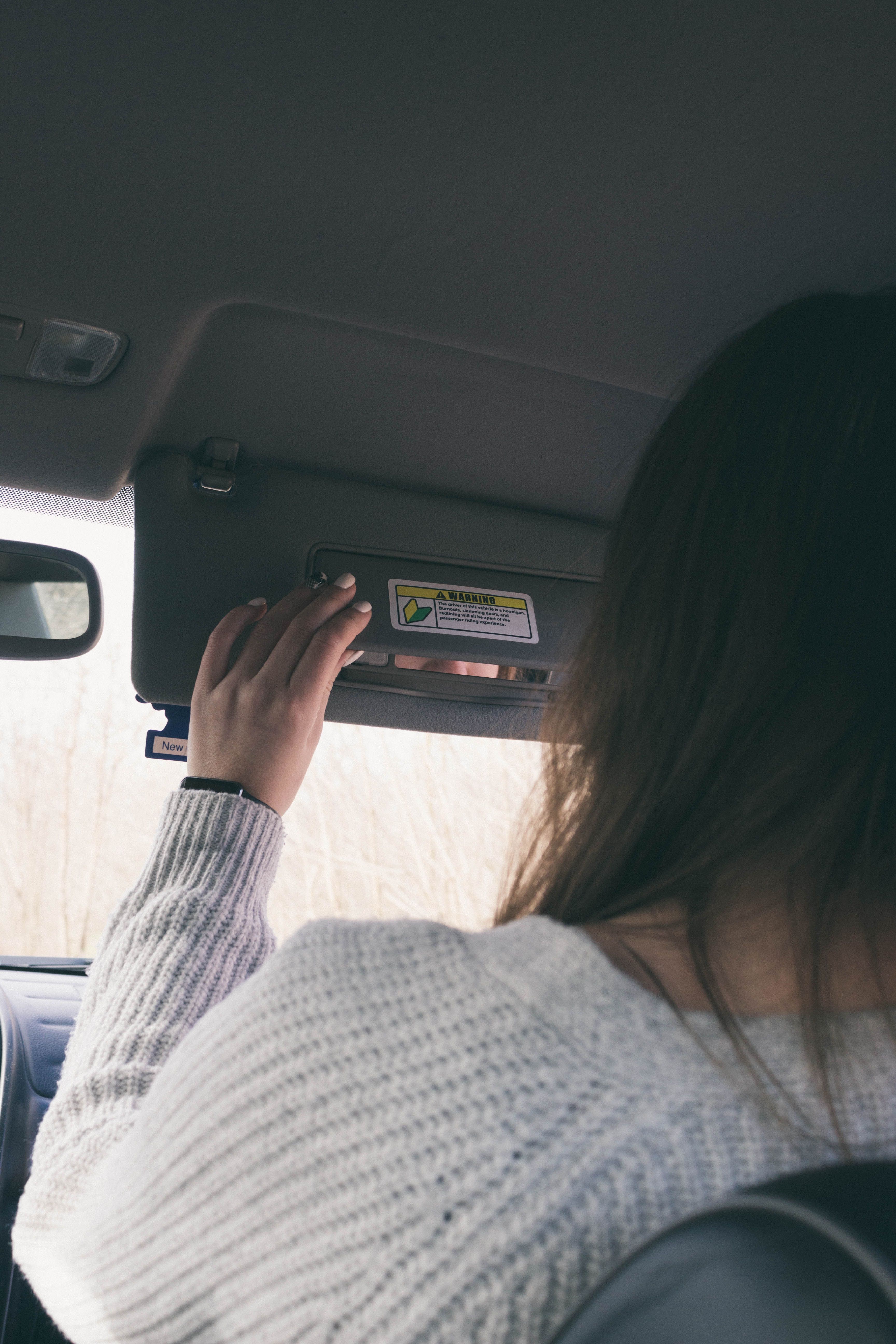 Woman in Sweater Sitting Inside Car Looking Out the Window · Free Stock ...