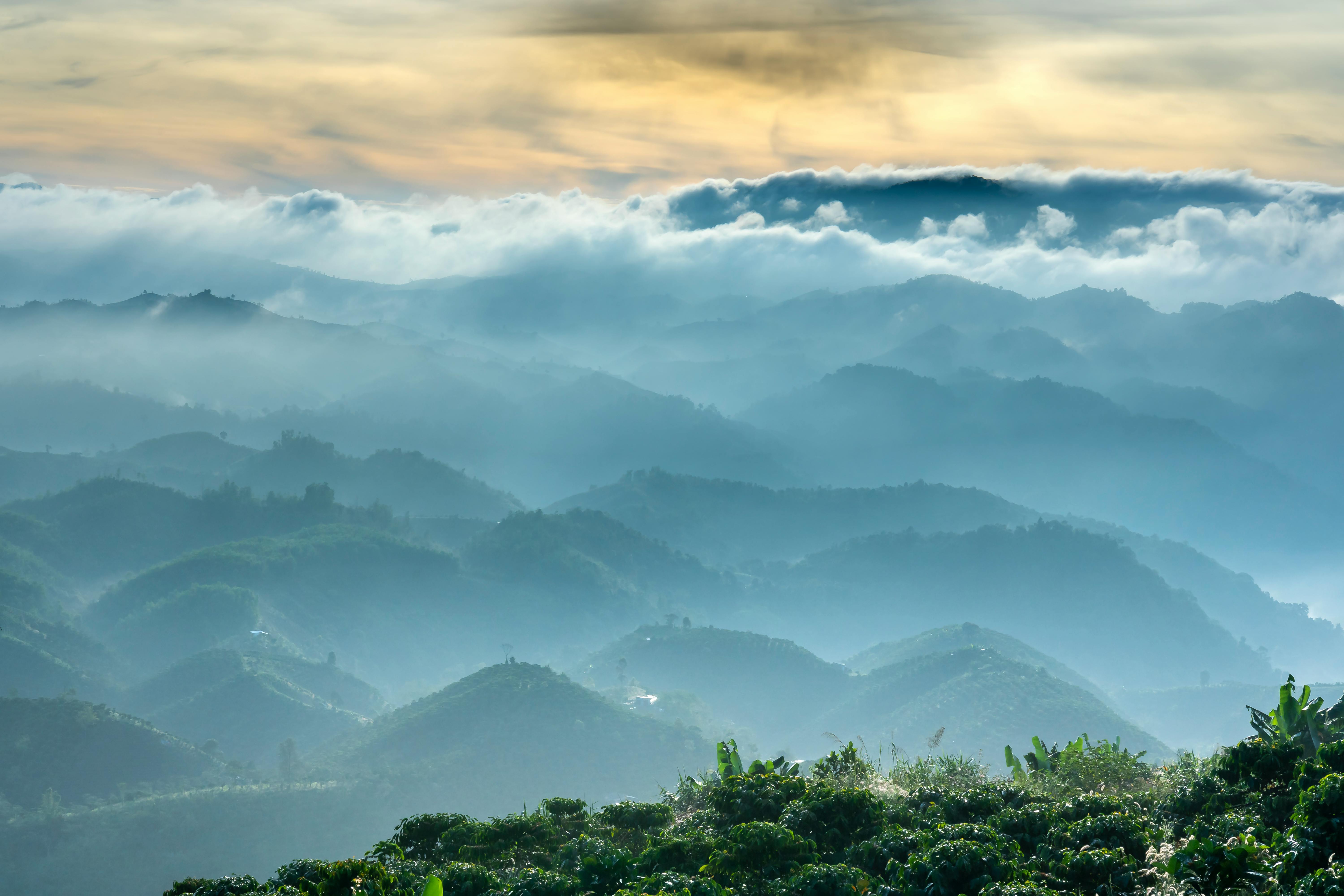 High Angle View of Hills Covered by Clouds and Fog at Dawn · Free Stock ...