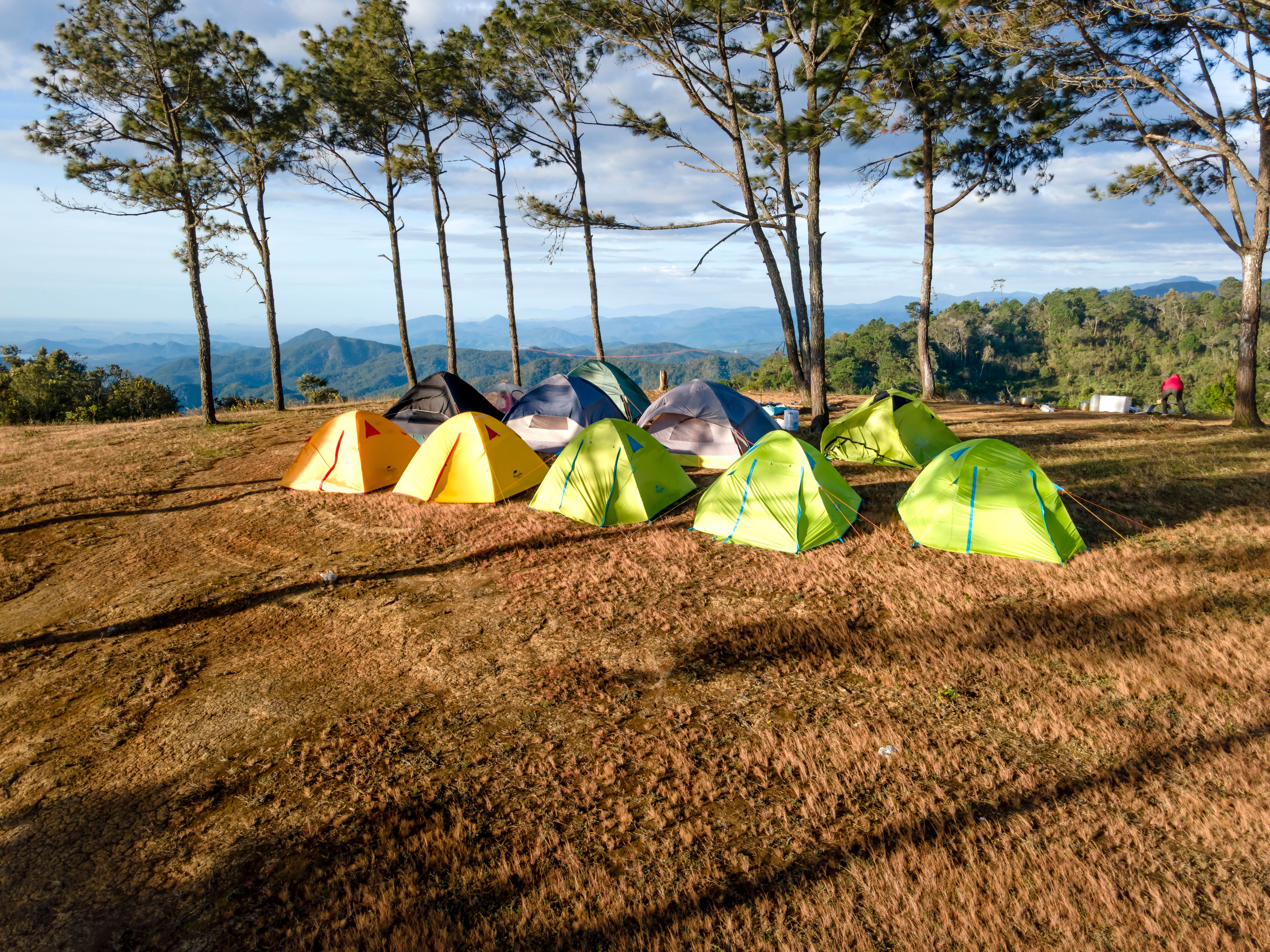 Tents on a Camping Site with Mountains in the Distance · Free Stock Photo
