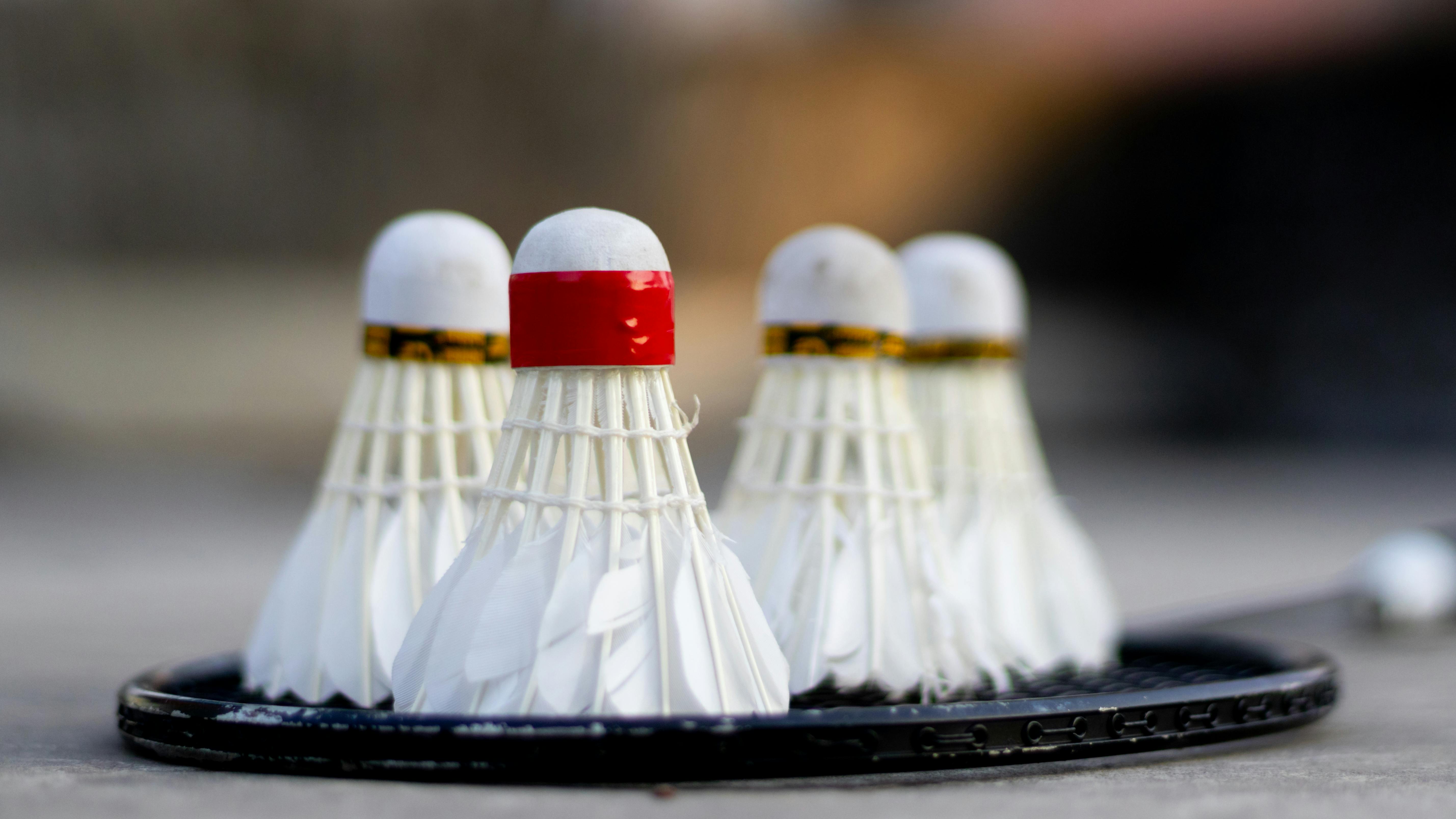 Close Up Photo of Badminton Rackets and Shuttlecock · Free Stock Photo