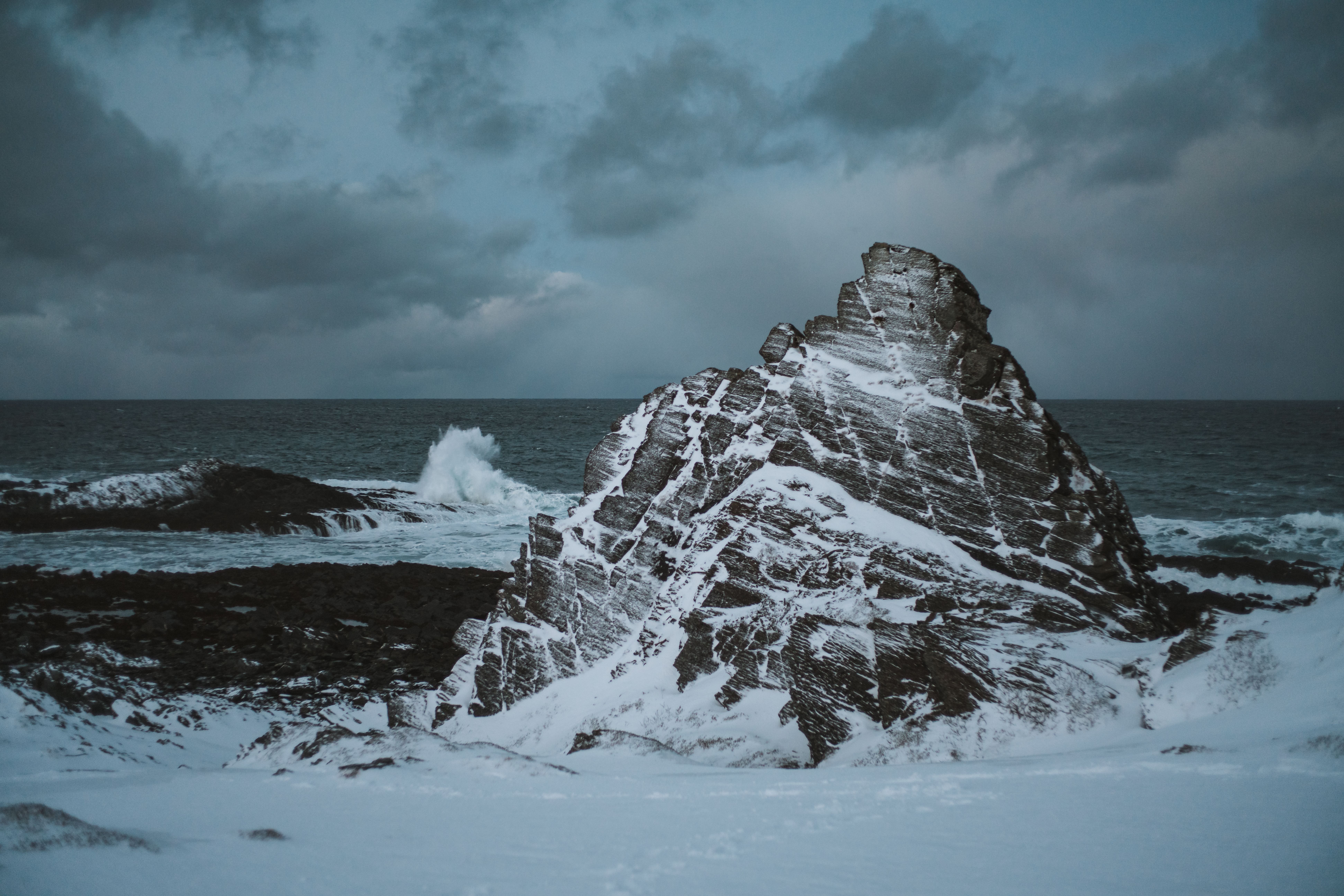 Snow Covered Land Near Body of Water · Free Stock Photo