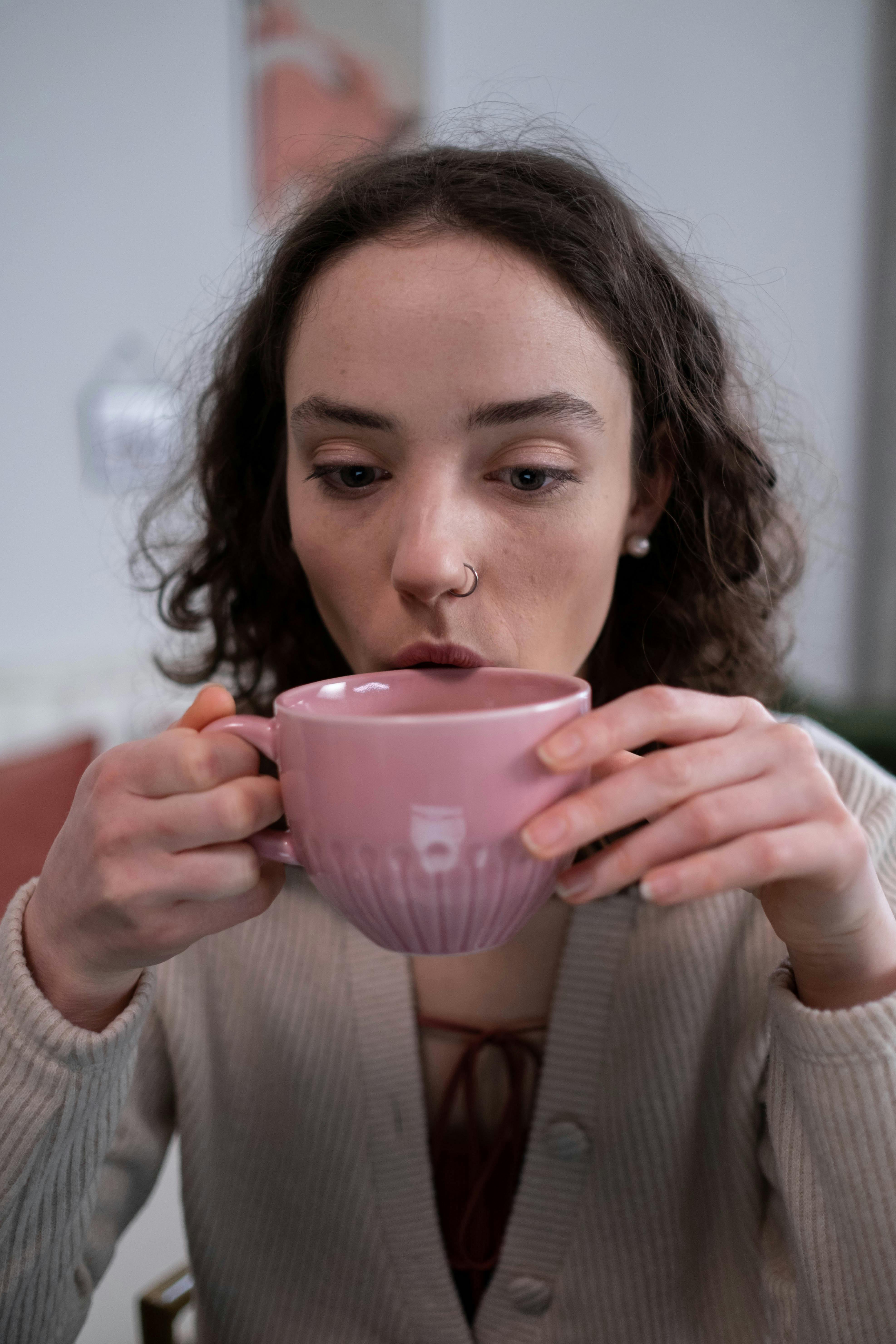 A Woman Drinking a Tea · Free Stock Photo