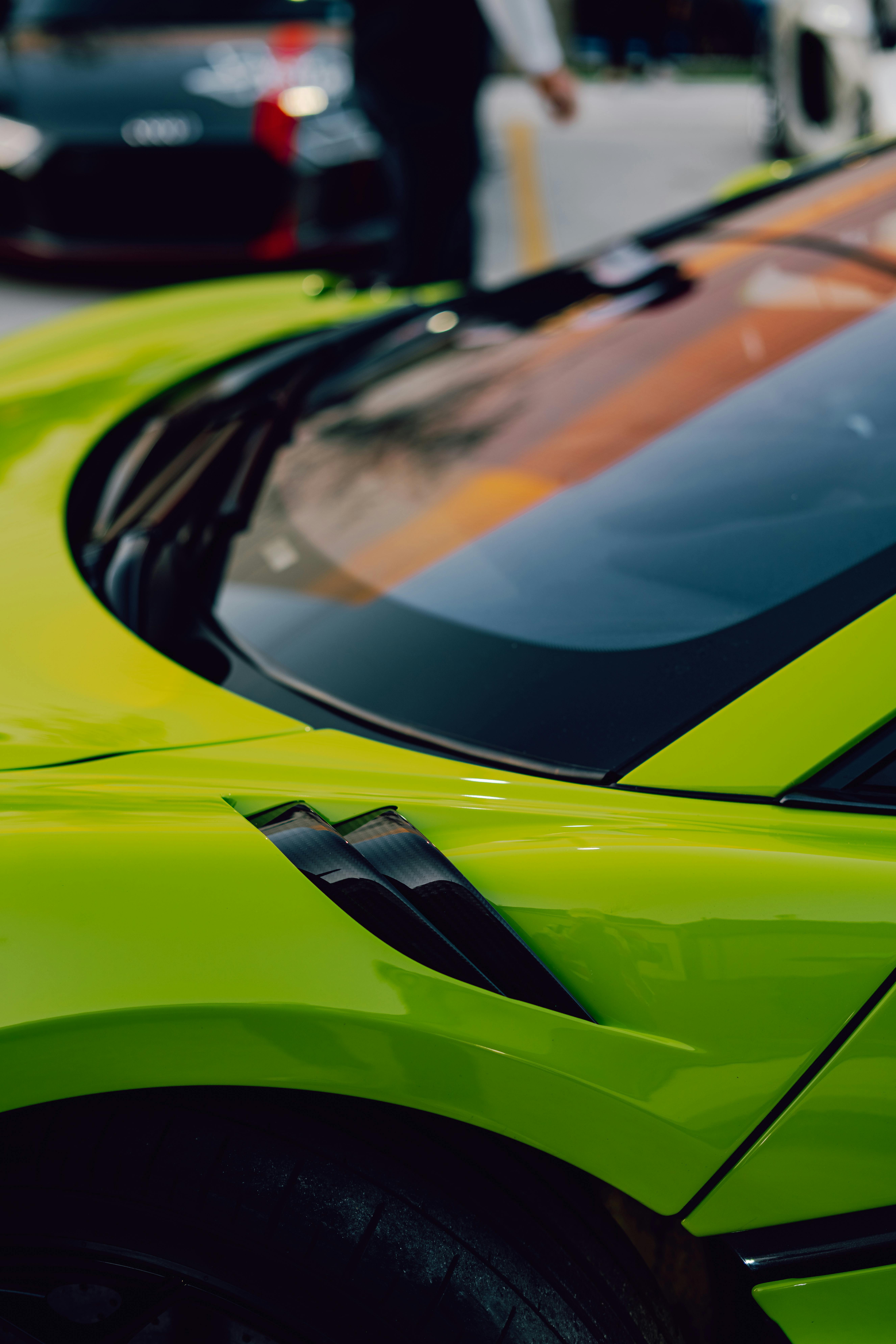 Close-Up Shot of a Neon Green Car · Free Stock Photo