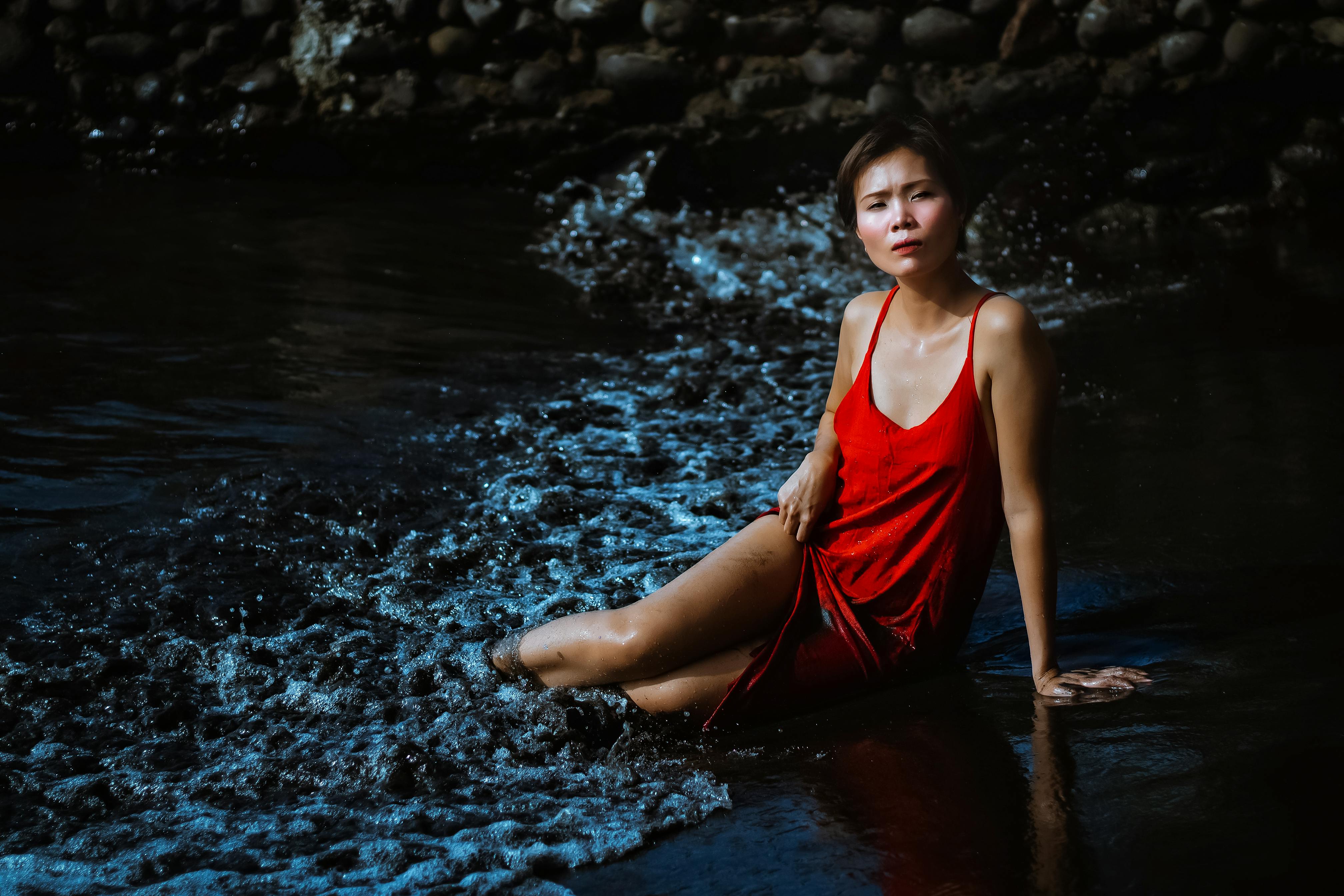 African American female on stony rock near sand and mountain · Free ...