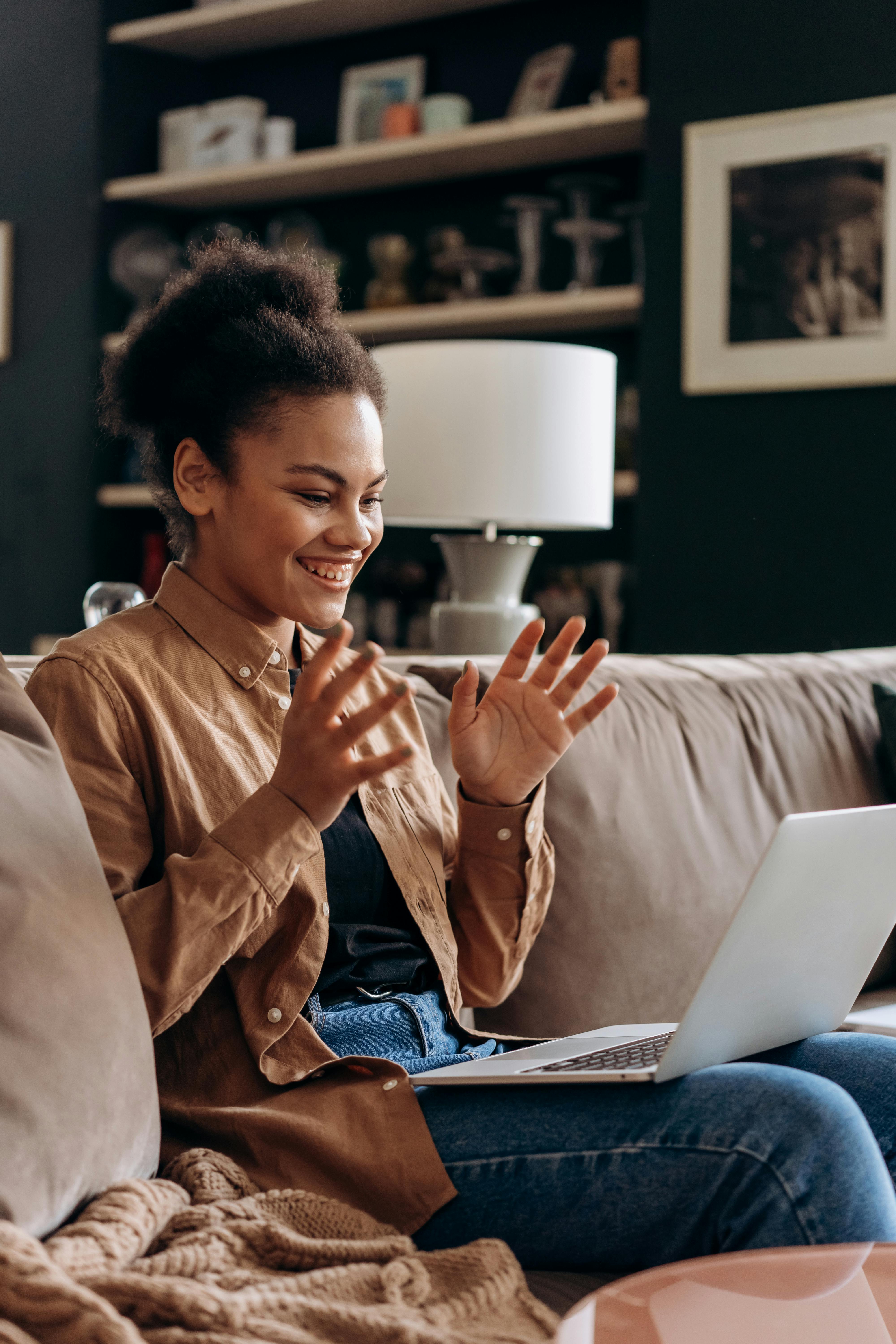 A Happy Woman using a Laptop · Free Stock Photo