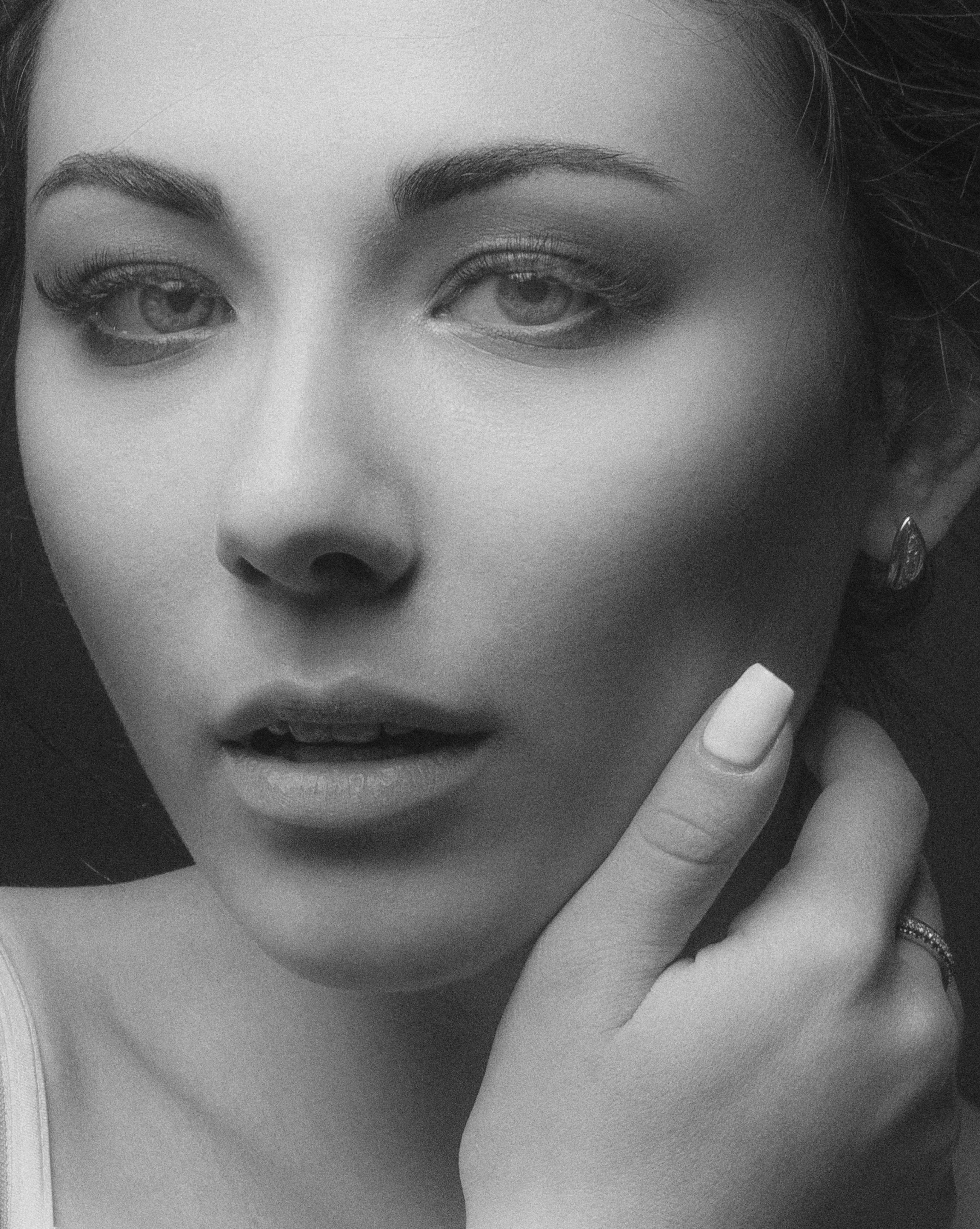 Grayscale Photo of Woman With Hand on Face · Free Stock Photo